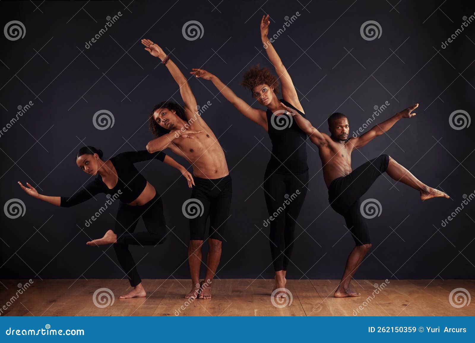 The Power of a Moment. a Group of Dancers Performing a Dramatic Pose in ...
