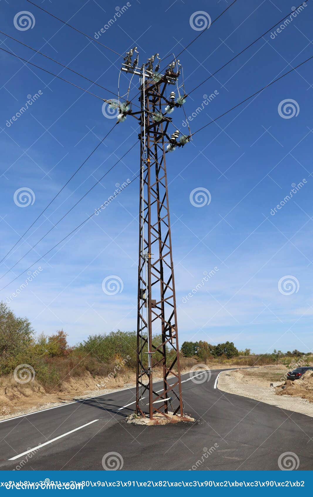 Power Pole in the Middle of the Road Stock Image - Image of power ...