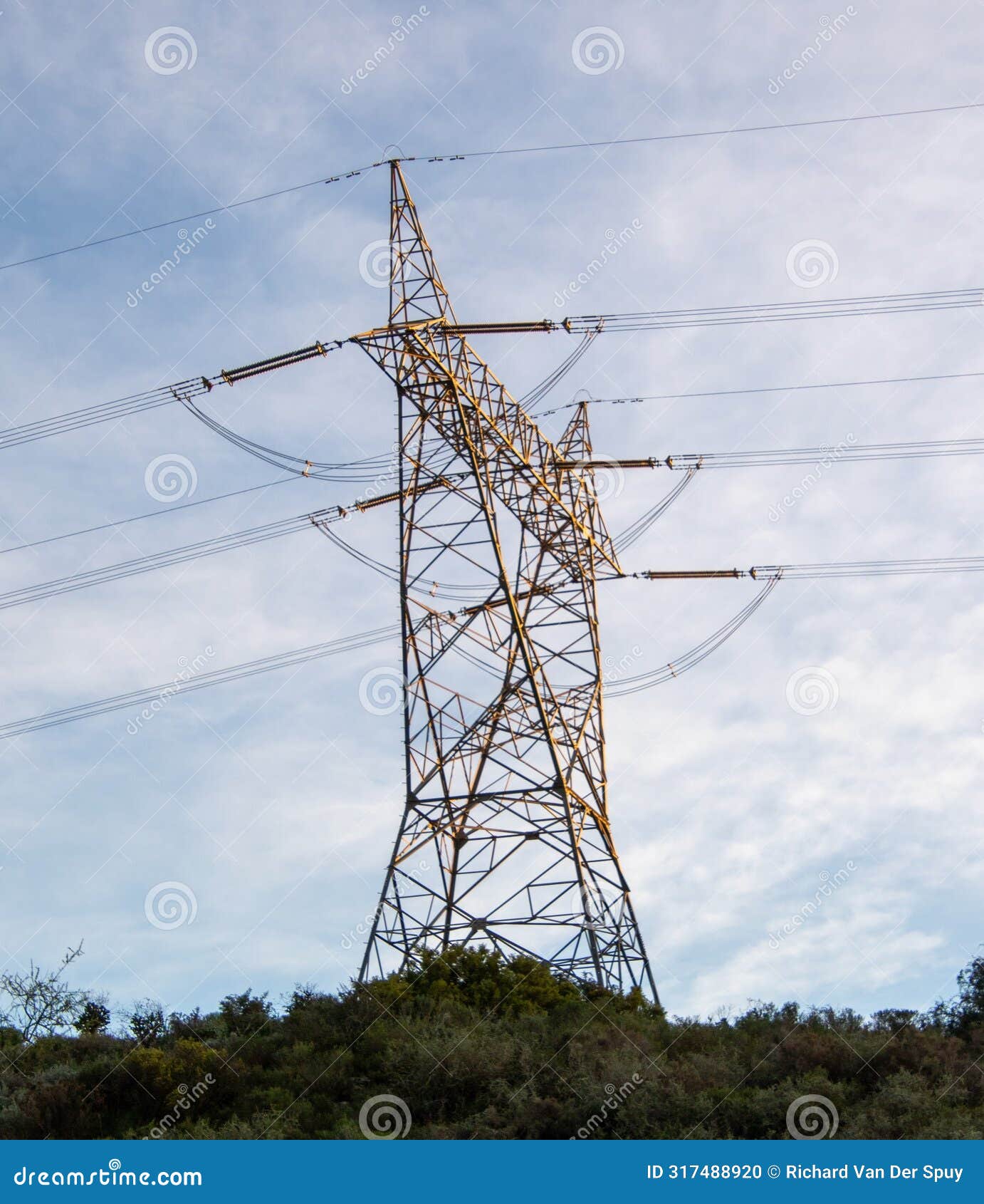 Power Pylon with Cables on Top of a Small Hill Stock Photo - Image of ...