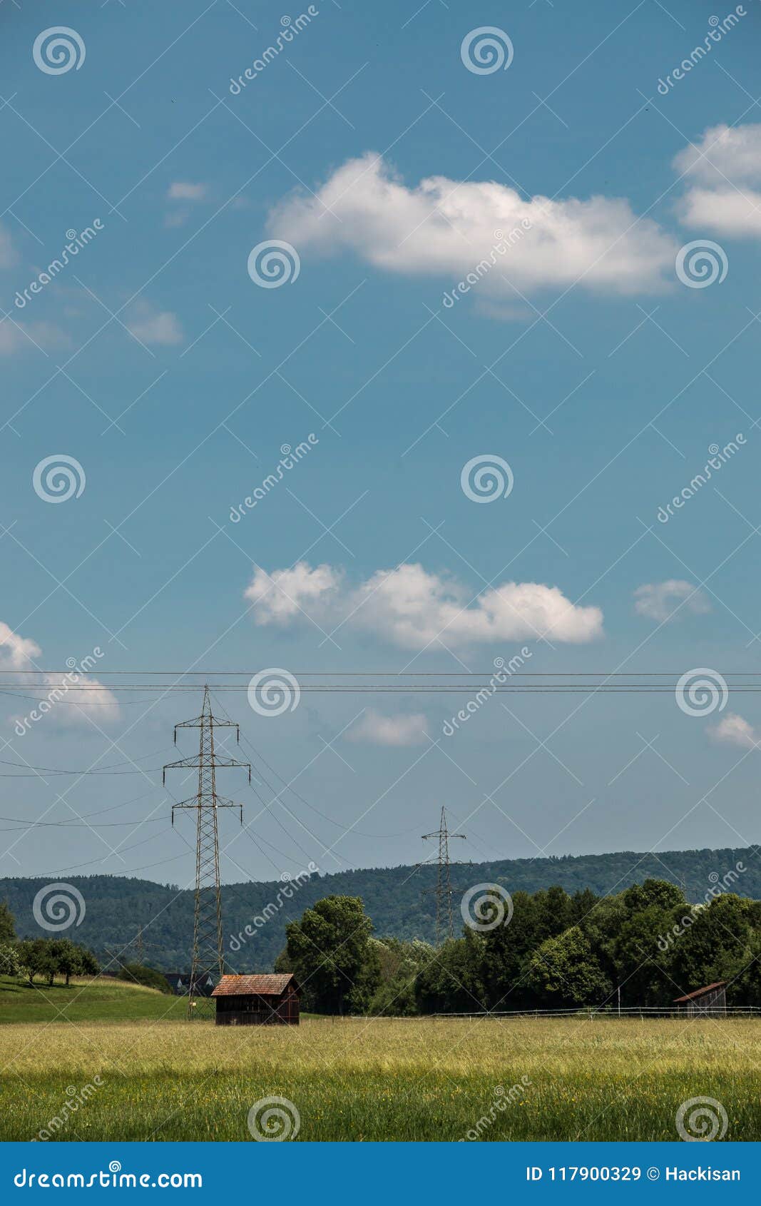 Power Pylon in the German Countryside with Forests, Fields and M Stock ...