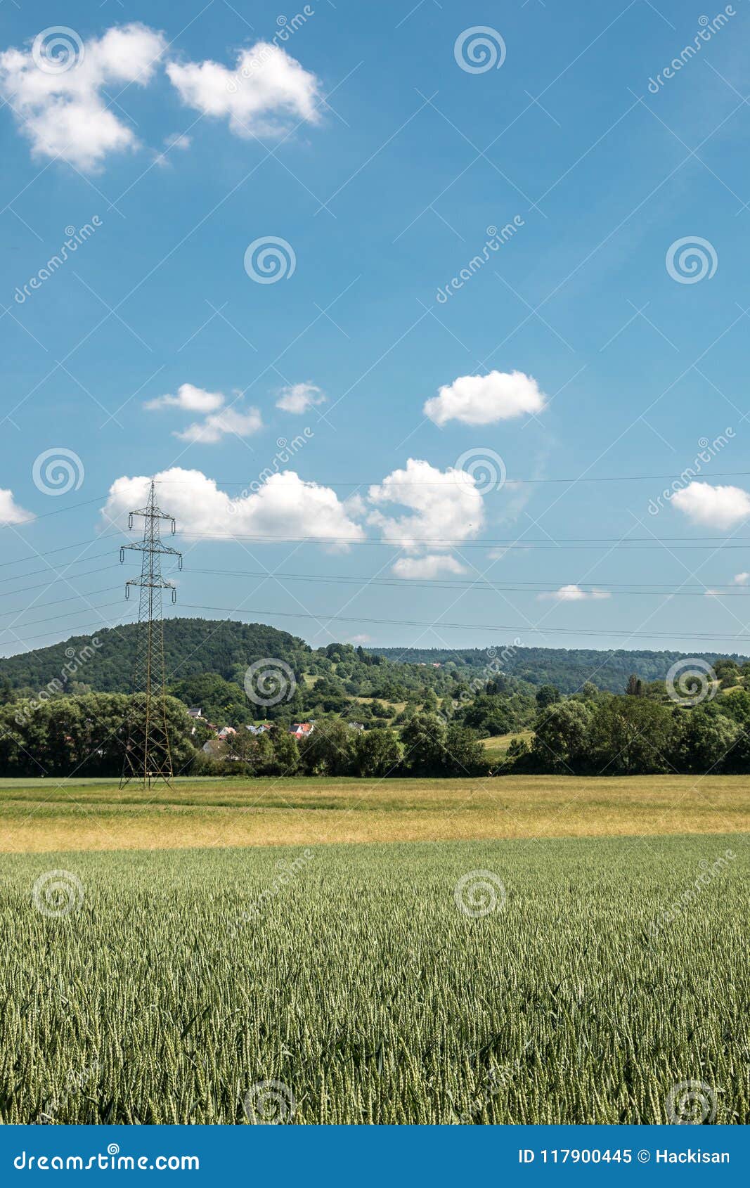 Power Pylon in the German Countryside with Forests, Fields and M Stock ...