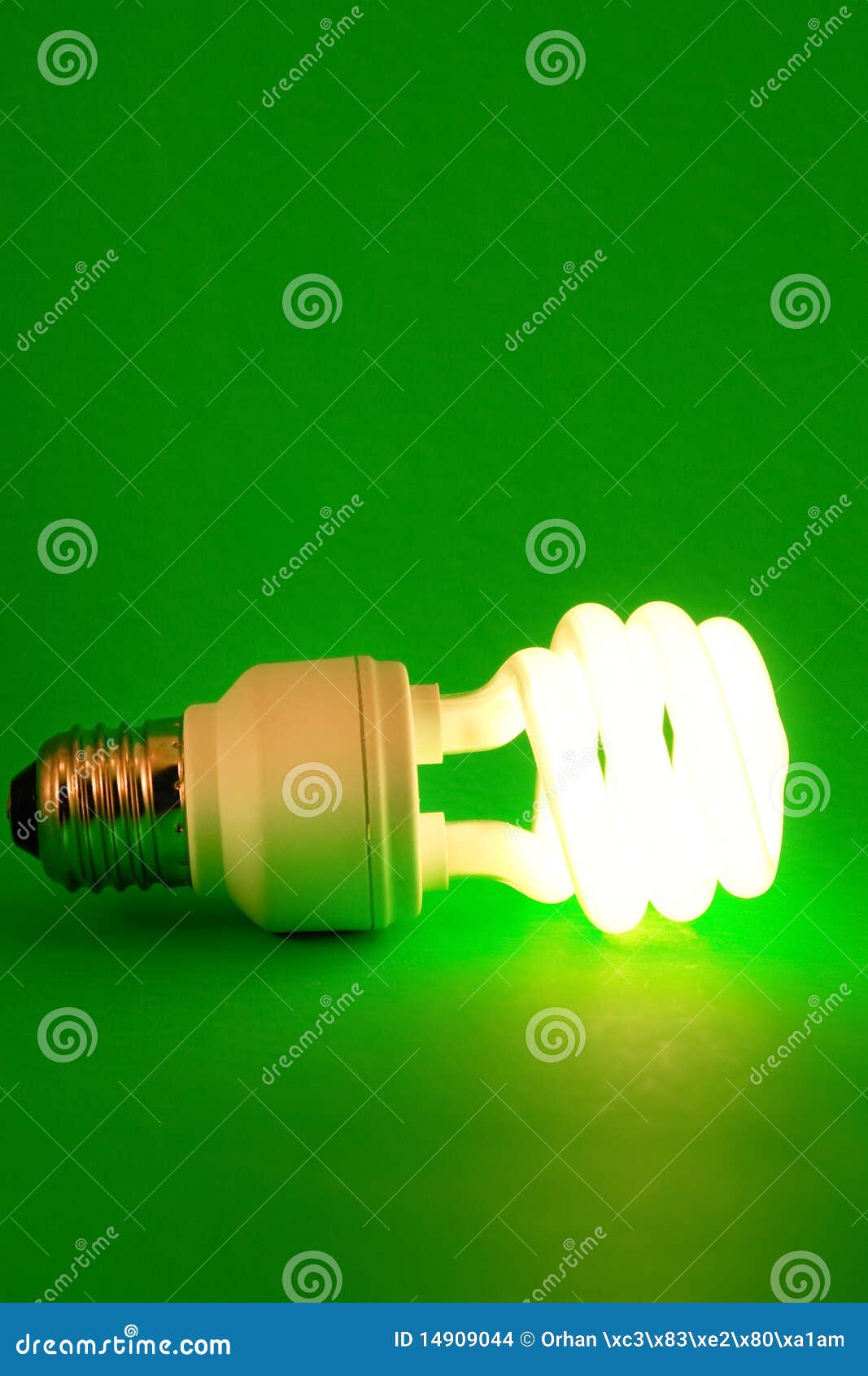Power-saving Light-bulb on Green Background Stock Photo - Image of ...
