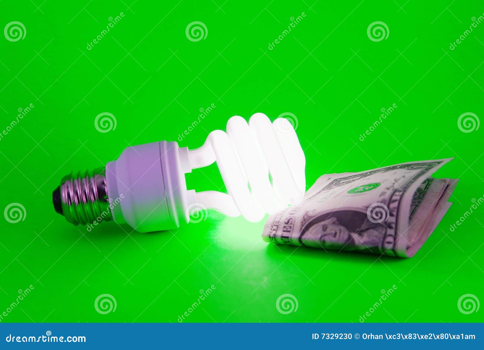 Power-saving Light-bulb on Green Background Stock Photo - Image of ...