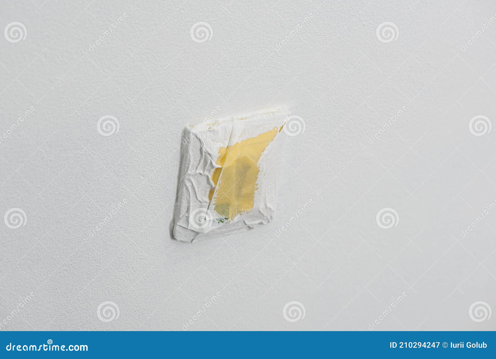 Power Socket Covered with Masking Tape while the White Wall Being ...