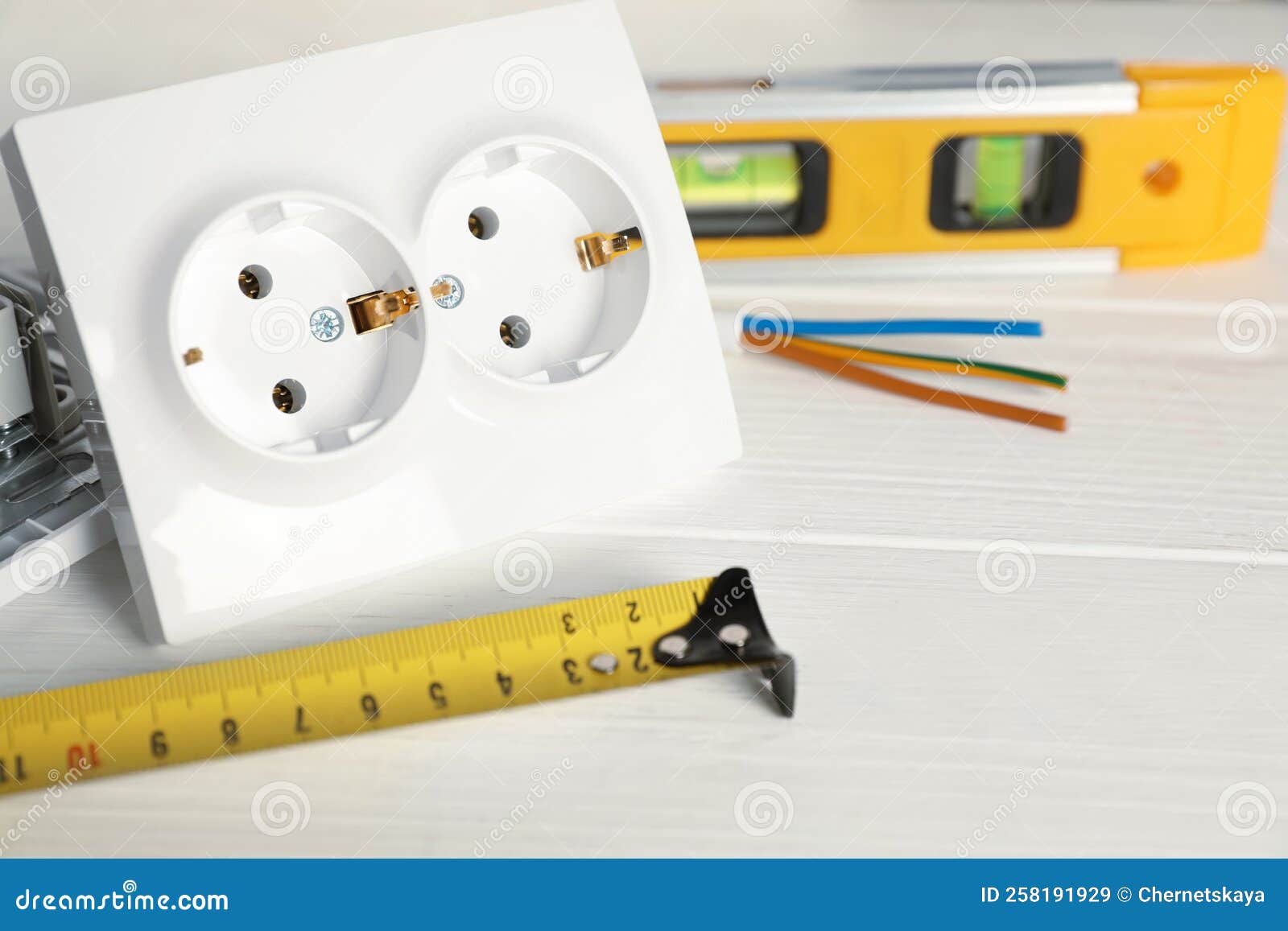 Power Socket and Set of Electrician`s Tools on White Wooden Table ...