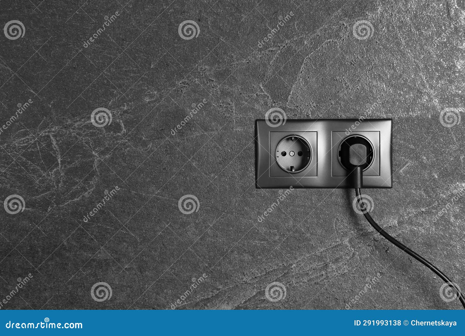 Power Sockets with Inserted Plug on Dark Grey Wall, Space for Text ...