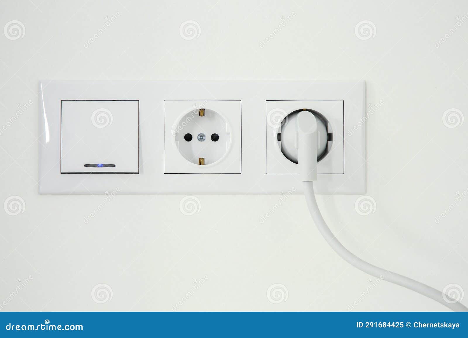 Power Sockets with Inserted Plug and Light Switch on White Wall Indoors ...
