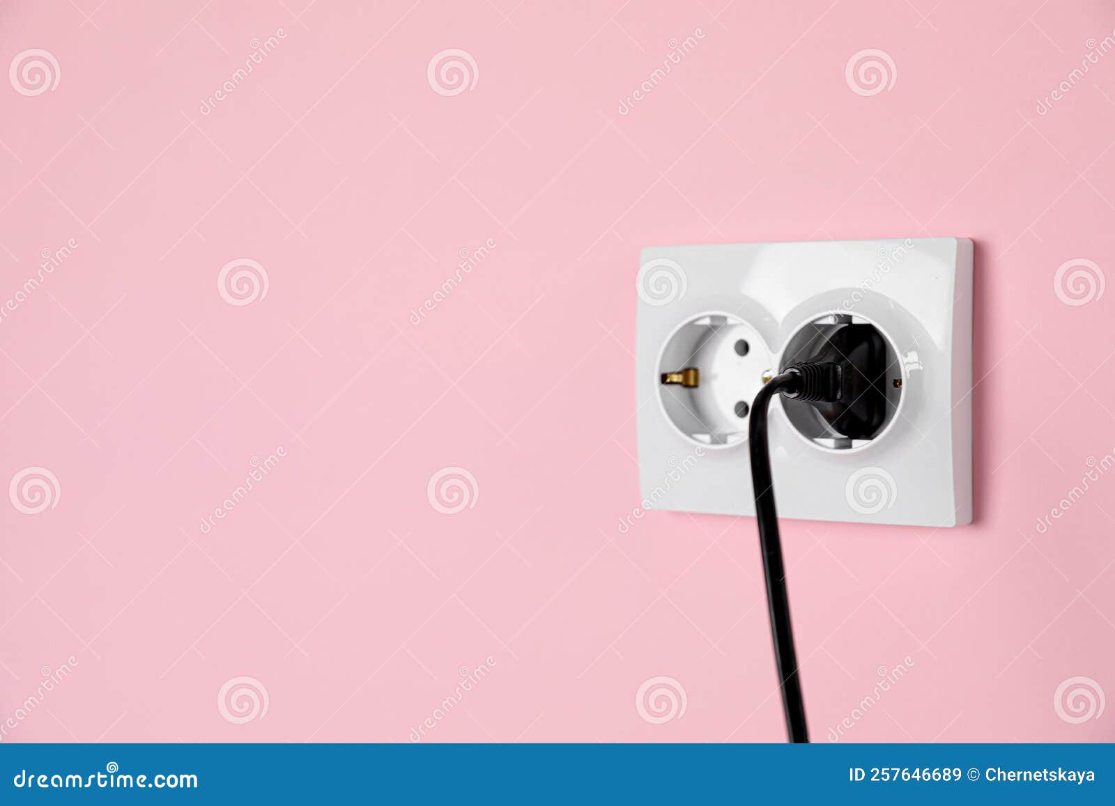 Power Sockets with Inserted Plug on Pink Wall, Space for Text ...