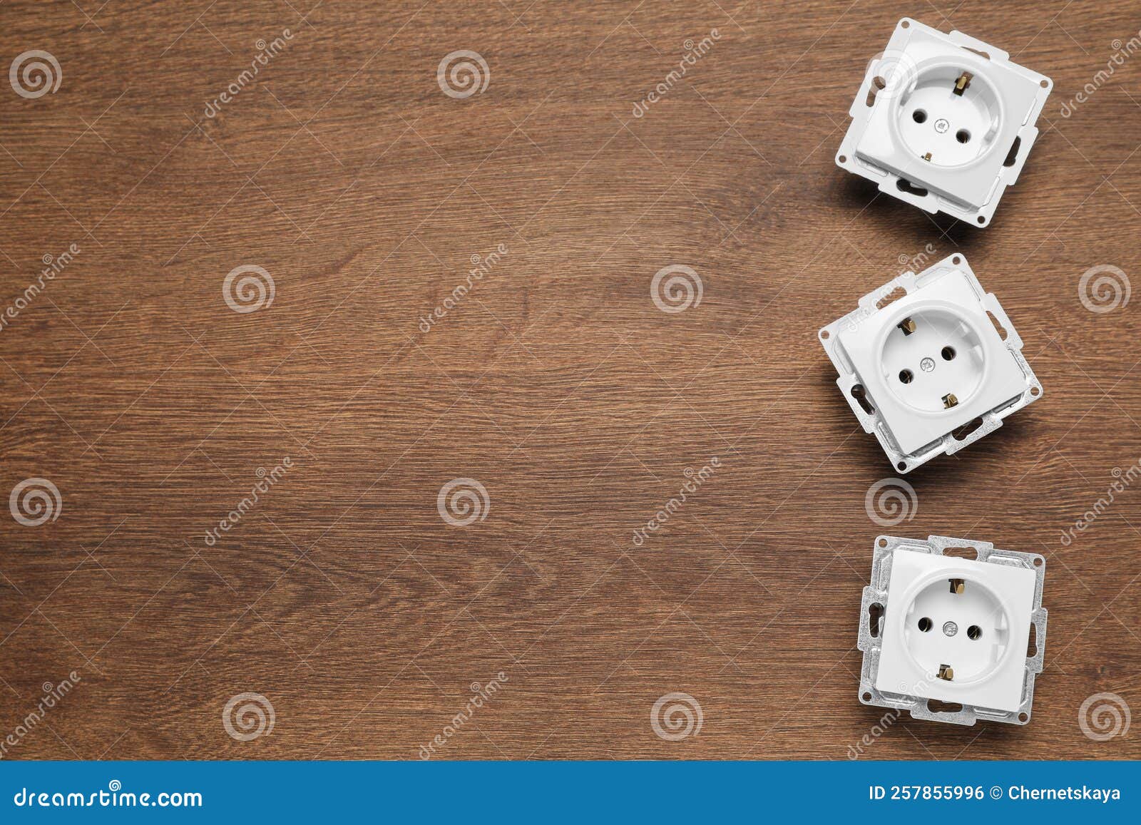 Power Sockets on Wooden Table, Flat Lay. Space for Text Stock Photo ...
