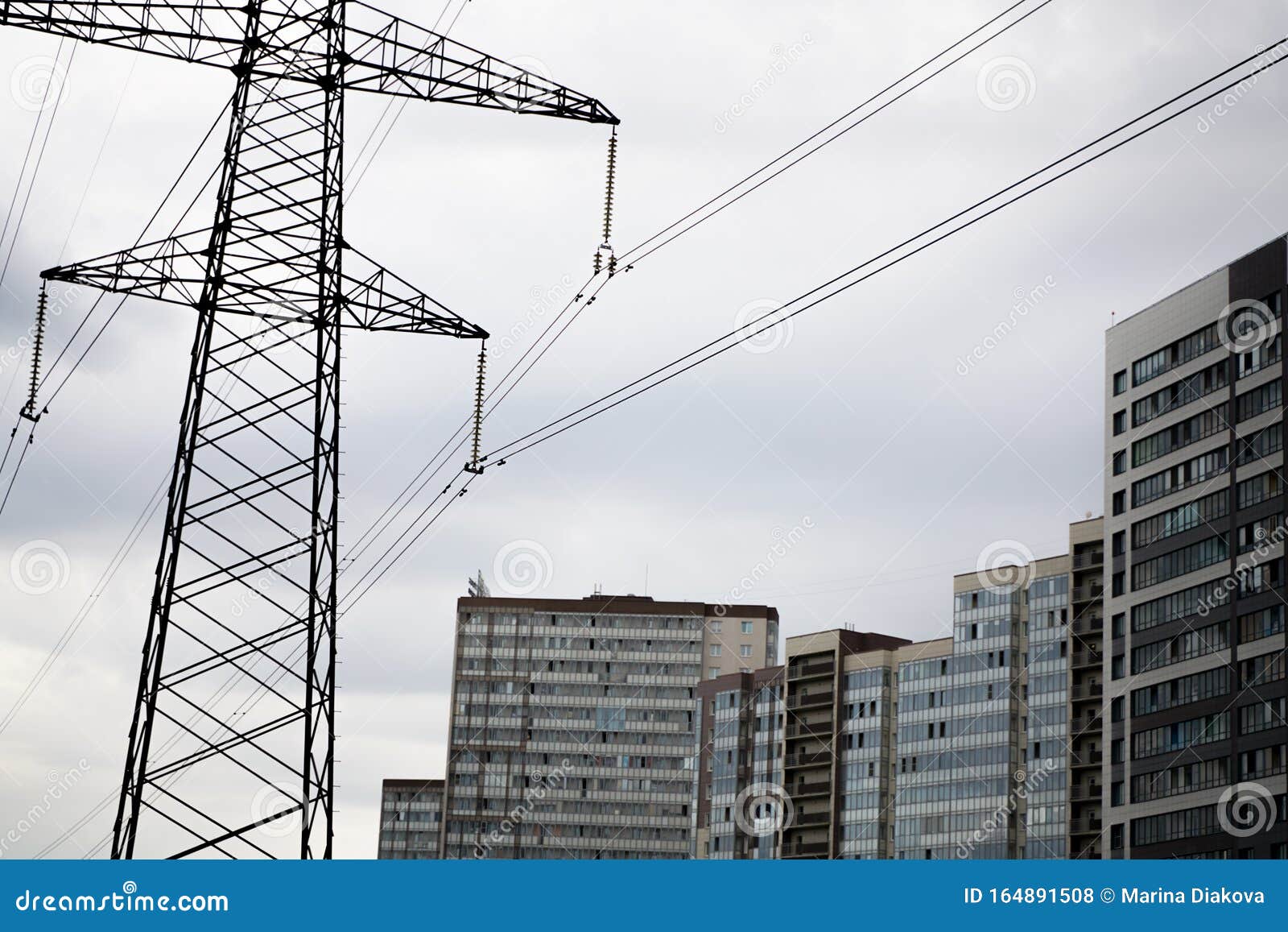 Power Transmission Line in the City with Cloudy Sky Stock Photo - Image ...