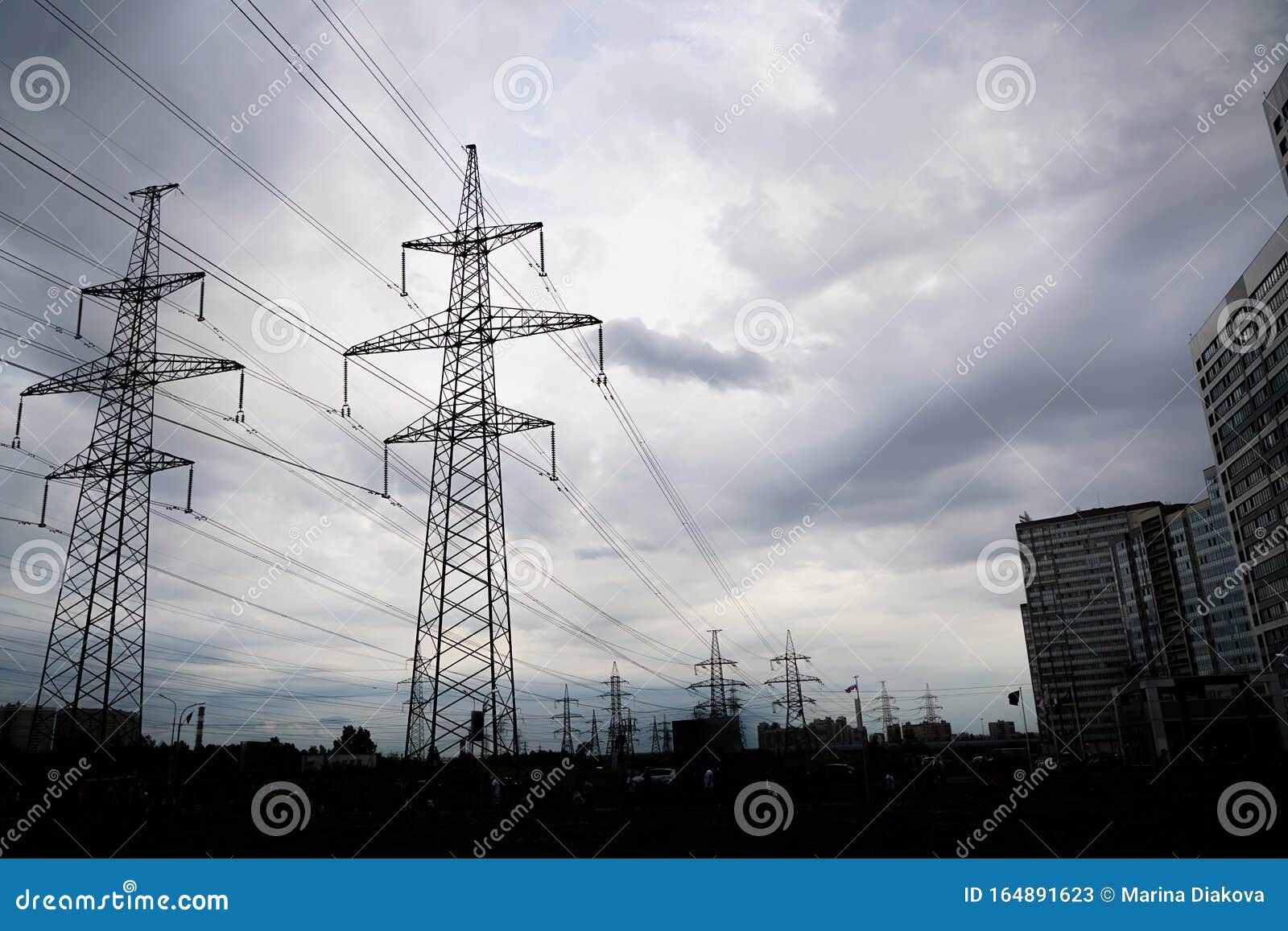 Power Transmission Line in the City with Cloudy Sky Stock Image - Image ...