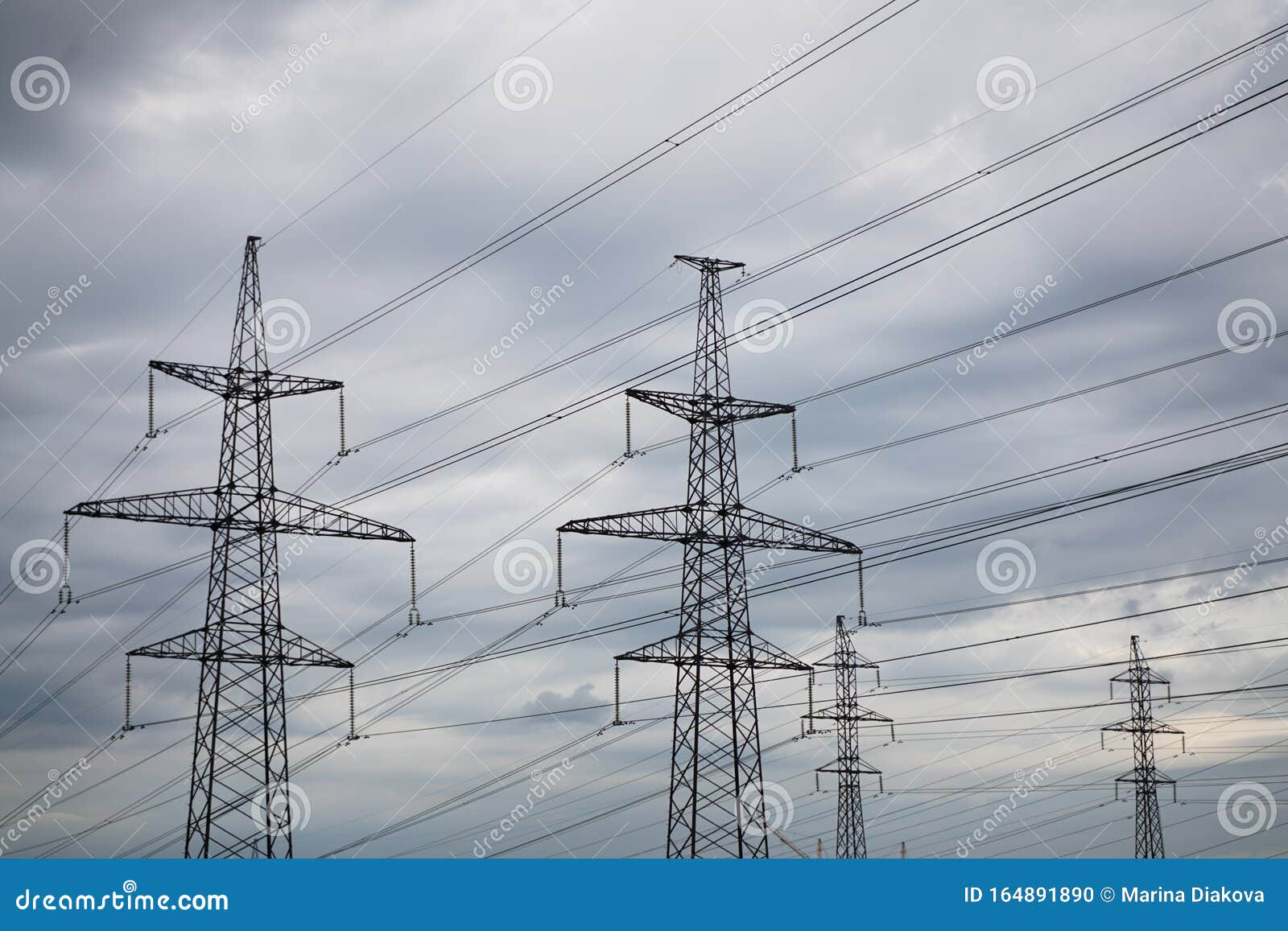 Power Transmission Line in the City with Cloudy Sky Stock Photo - Image ...