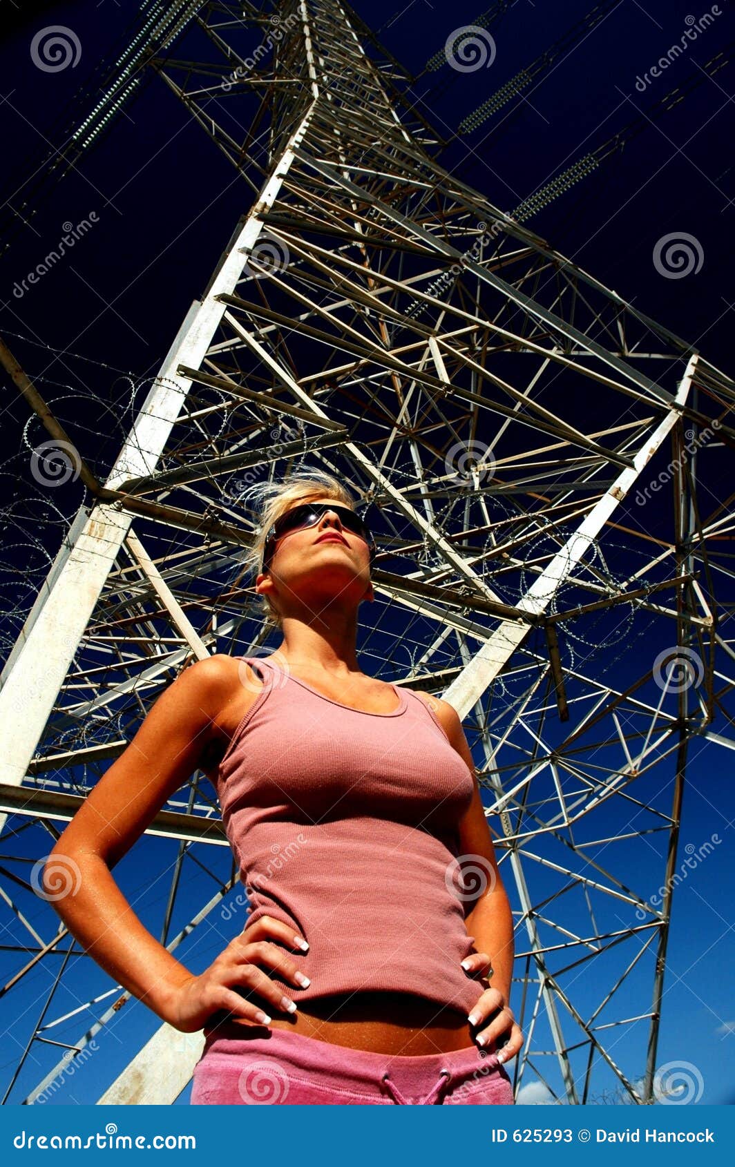 Woman in Front of High Voltage Power Lines Stock Image - Image of ...