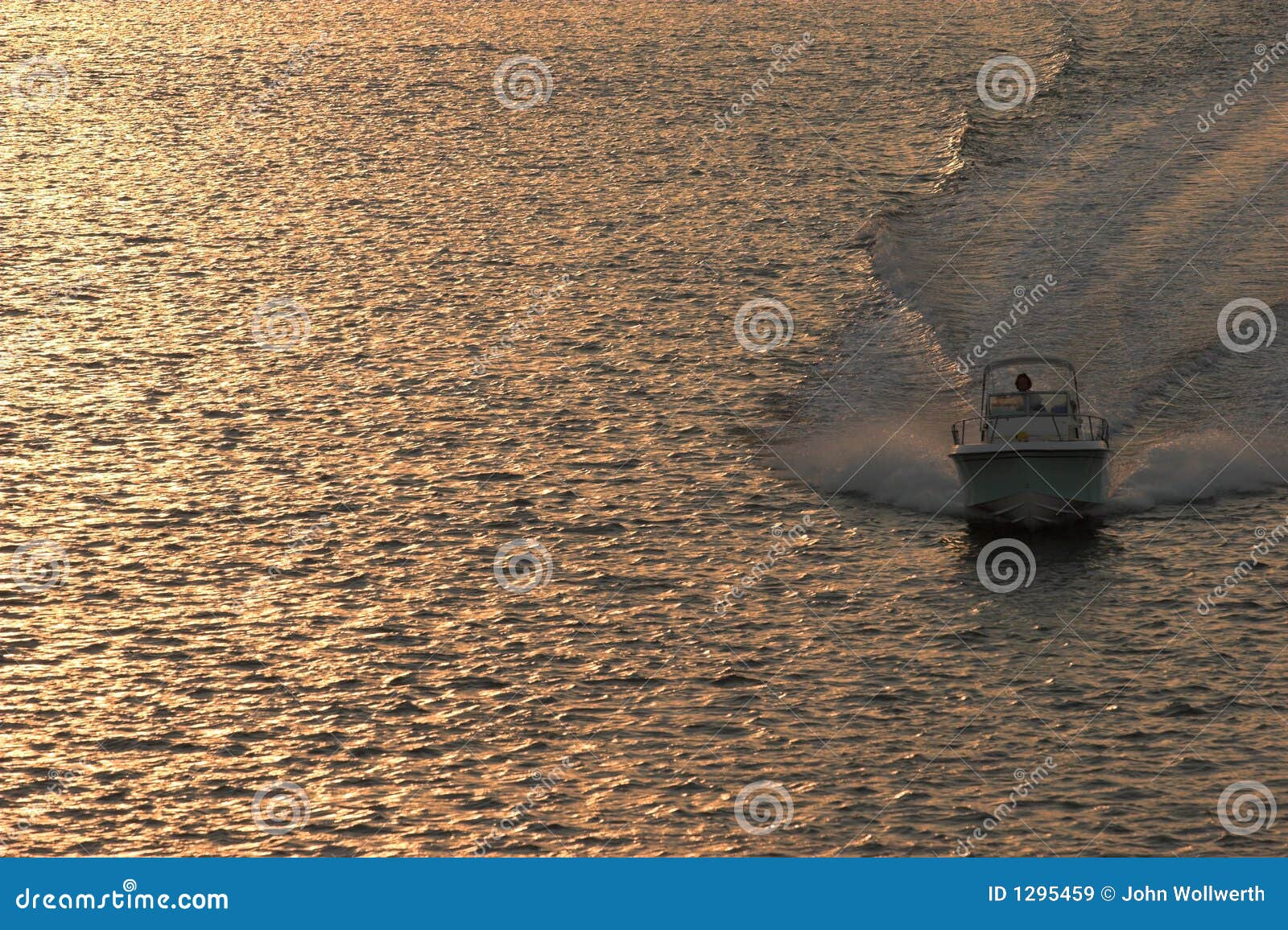 Powerboat at sunset stock image. Image of fast, power - 1295459