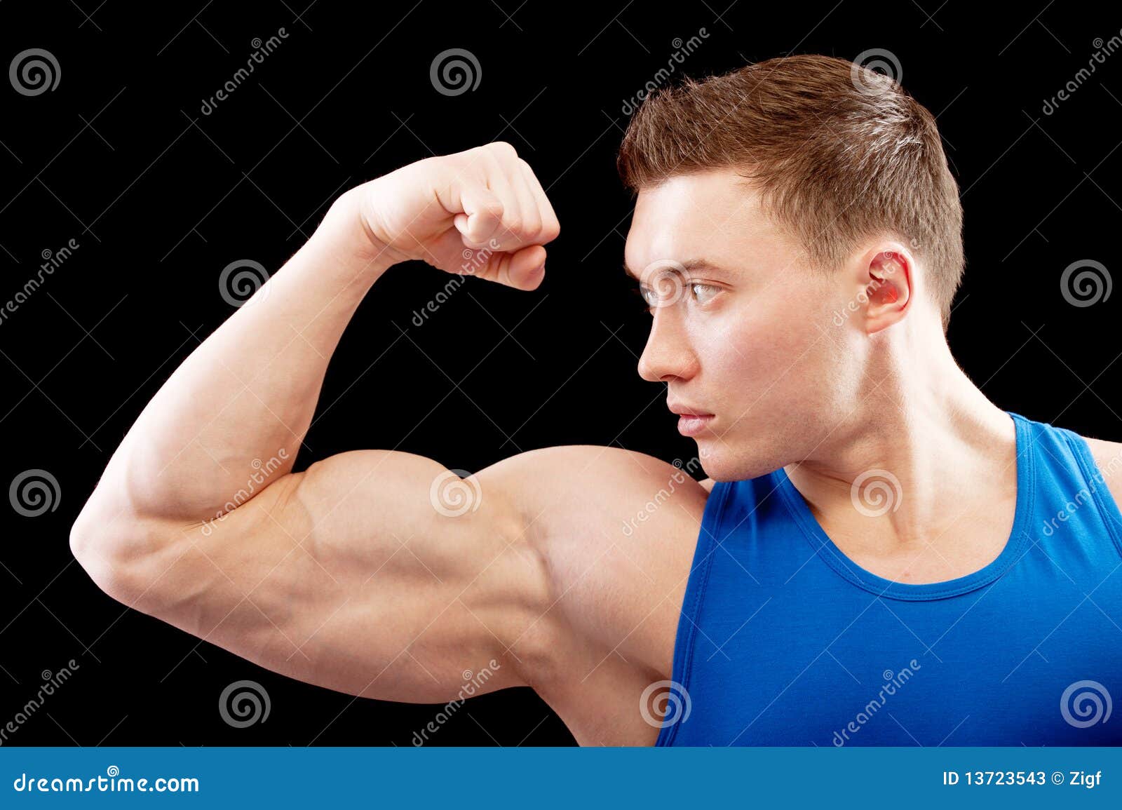 Powerful Body Builder Shows Biceps Photos - Free & Royalty-Free Stock ...