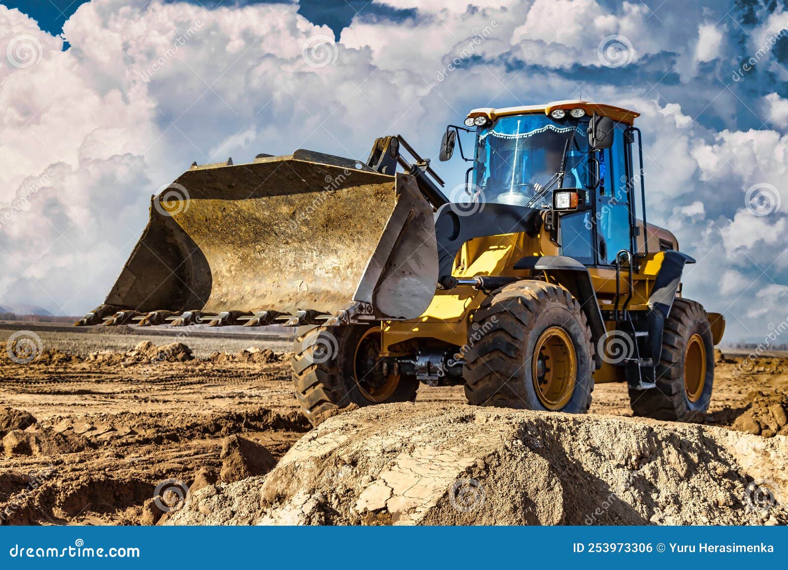 Powerful Bulldozer or Loader Moves the Earth at the Construction Site ...