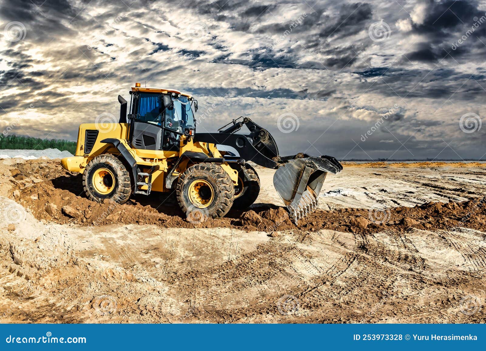 Powerful Bulldozer or Loader Moves the Earth at the Construction Site ...