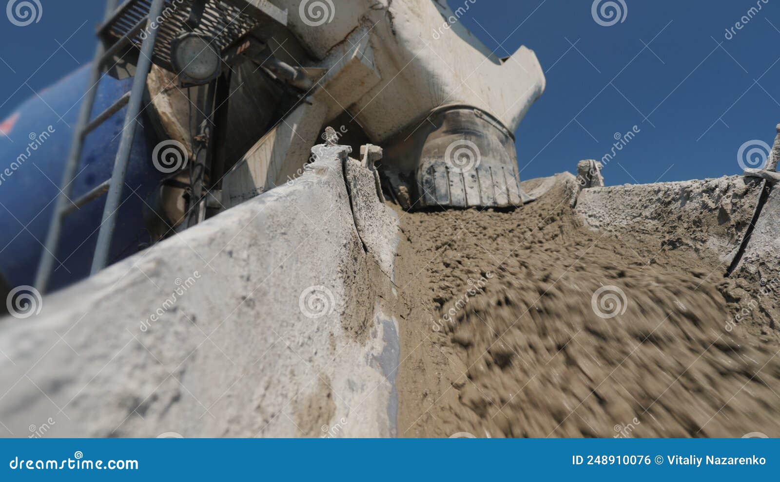 The Process of Unloading Concrete from a Concrete Manes Stock Photo ...
