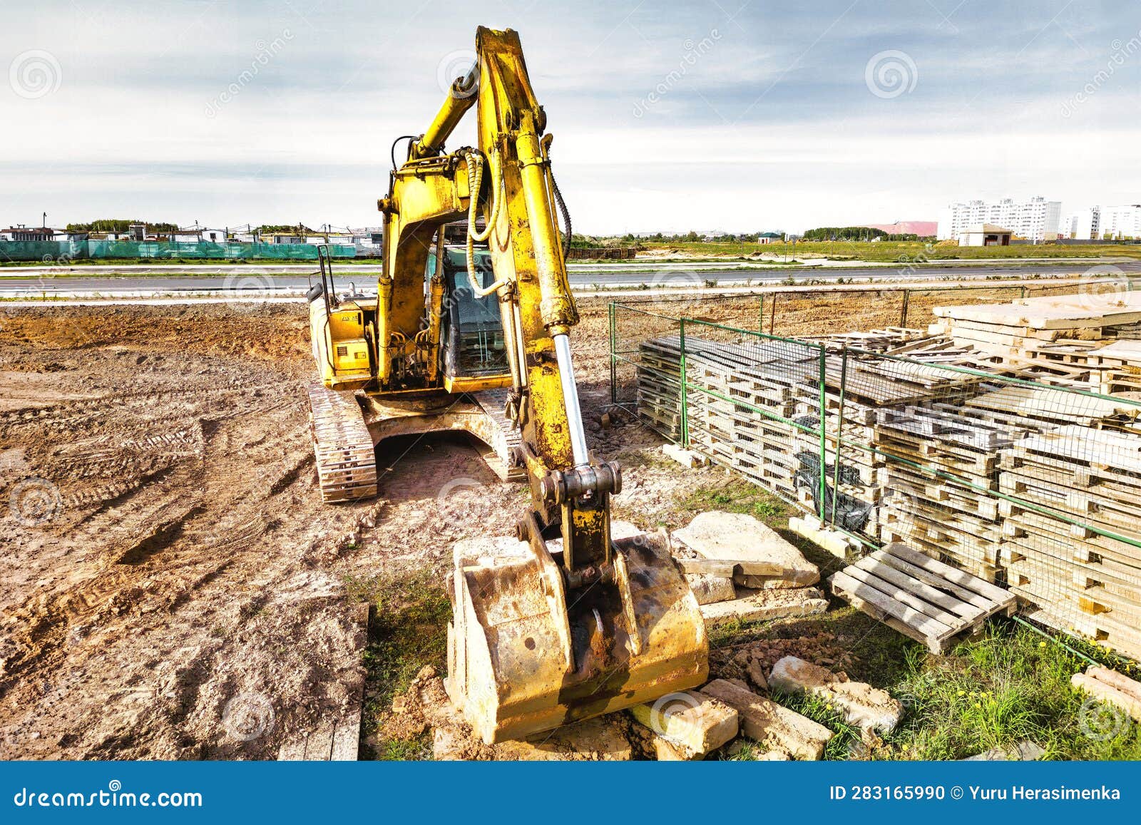 A Powerful Crawler Excavator is Working on a Construction Site. Close ...