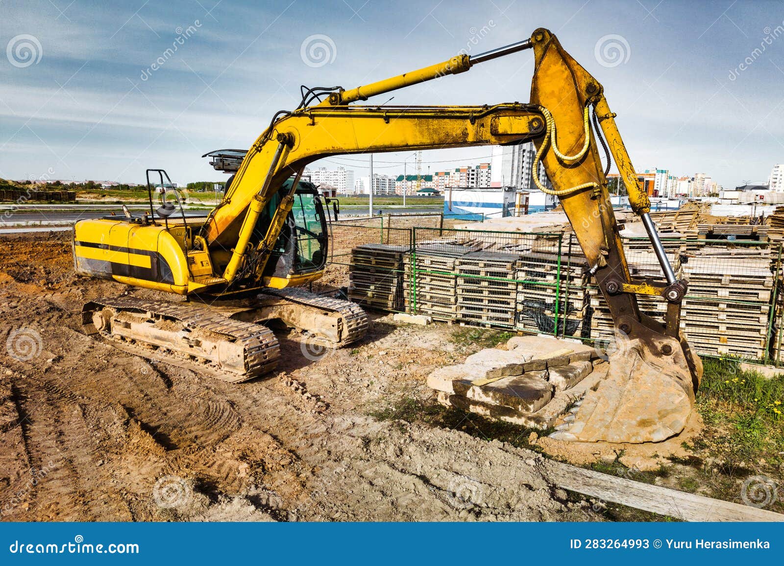 A Powerful Crawler Excavator is Working on a Construction Site. Close ...