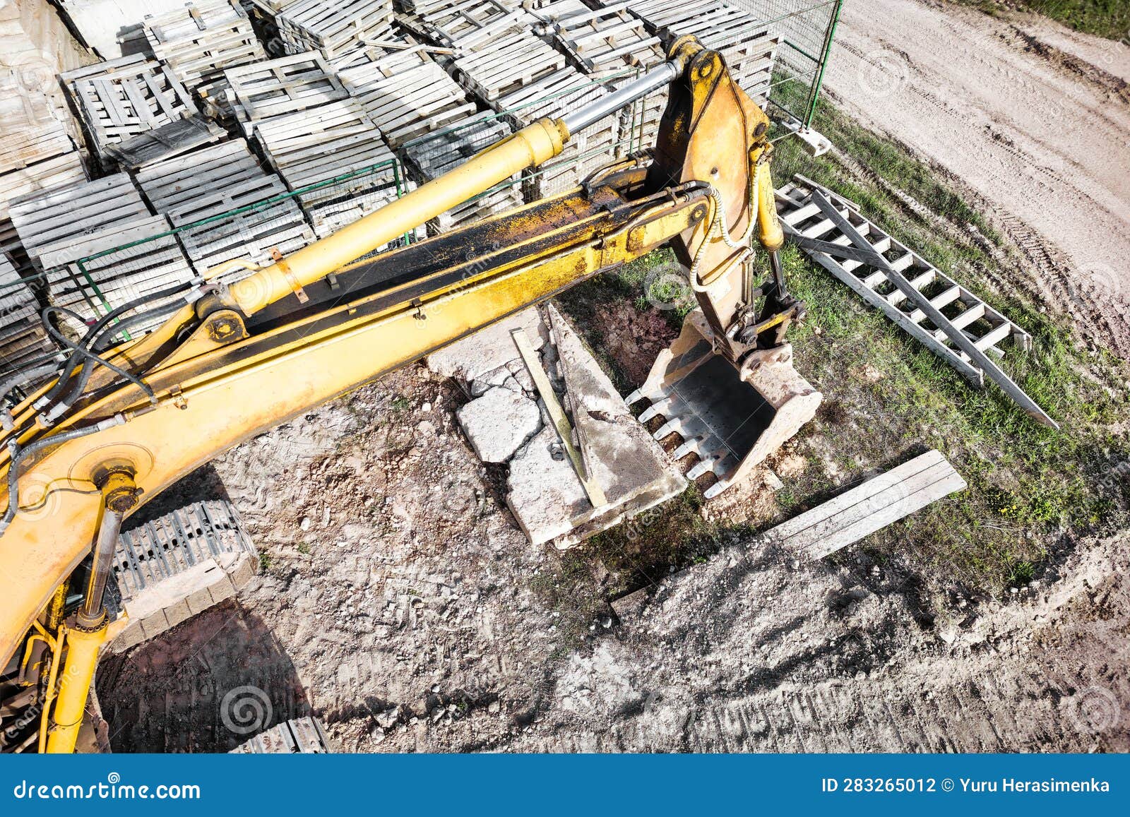 A Powerful Crawler Excavator Is Working On A Construction Site. Close ...