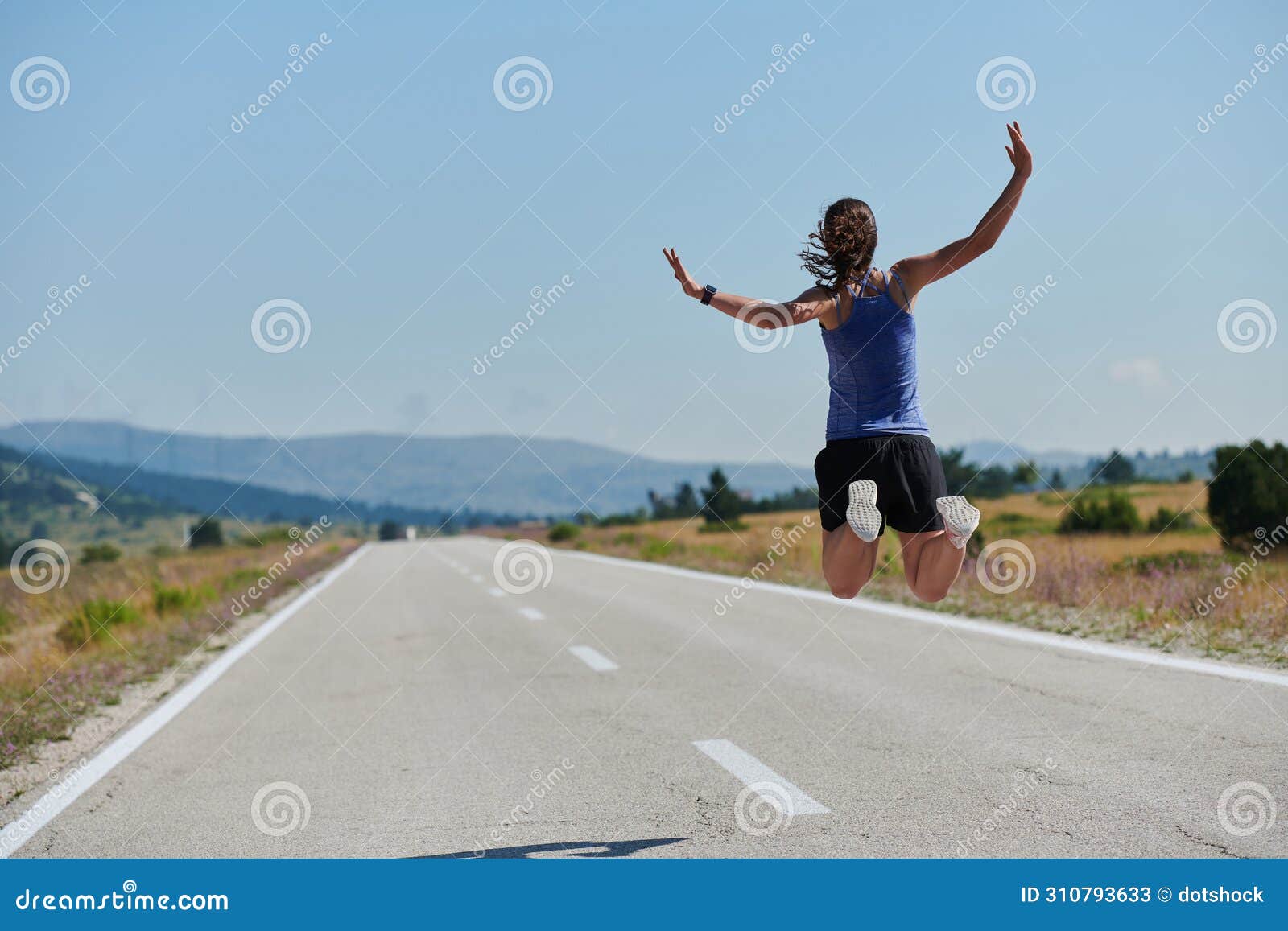 Leap of Victory: Athlete Symbolizes Success and Dedication through Mid ...