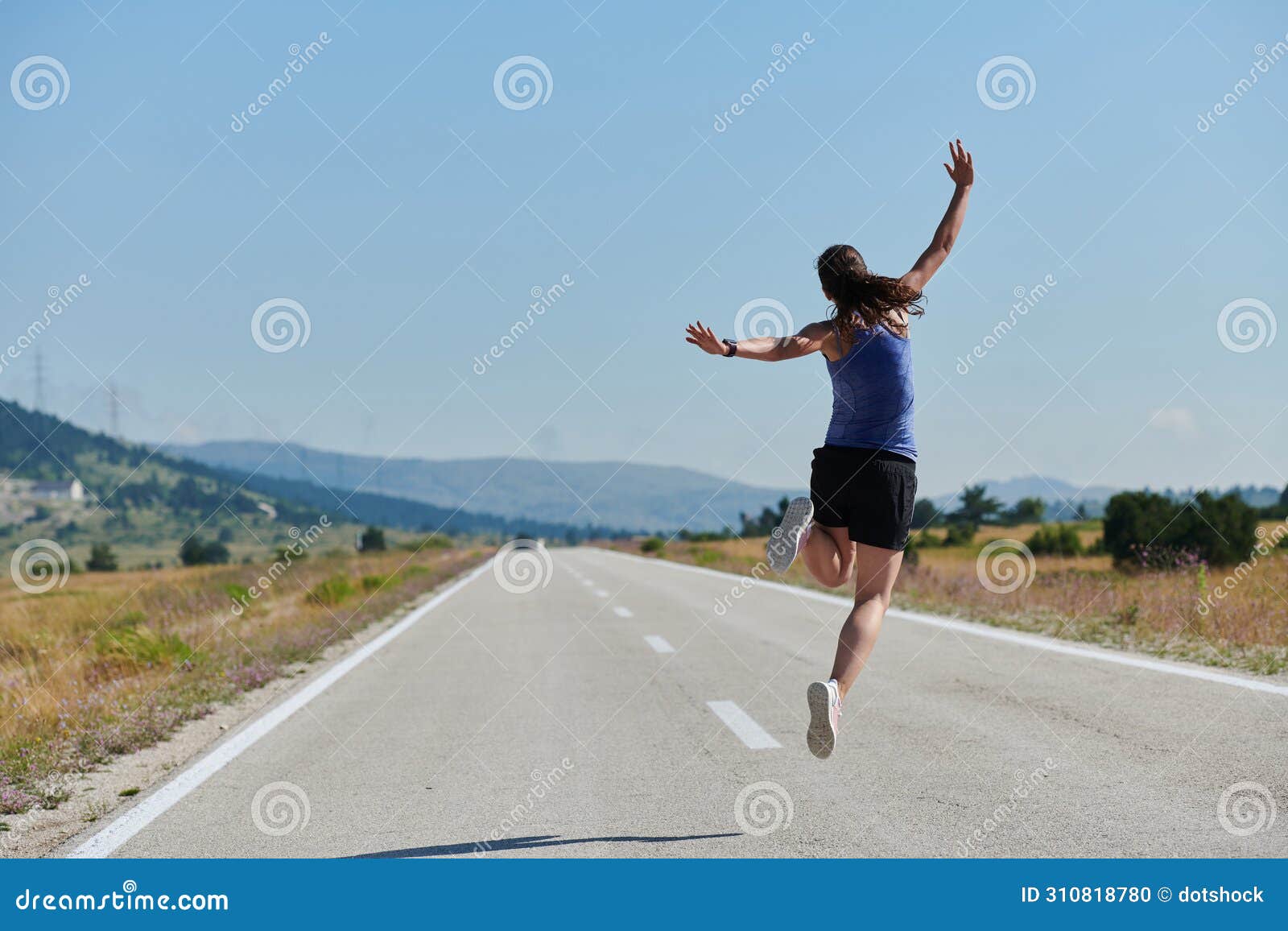 Leap of Victory: Athlete Symbolizes Success and Dedication through Mid ...