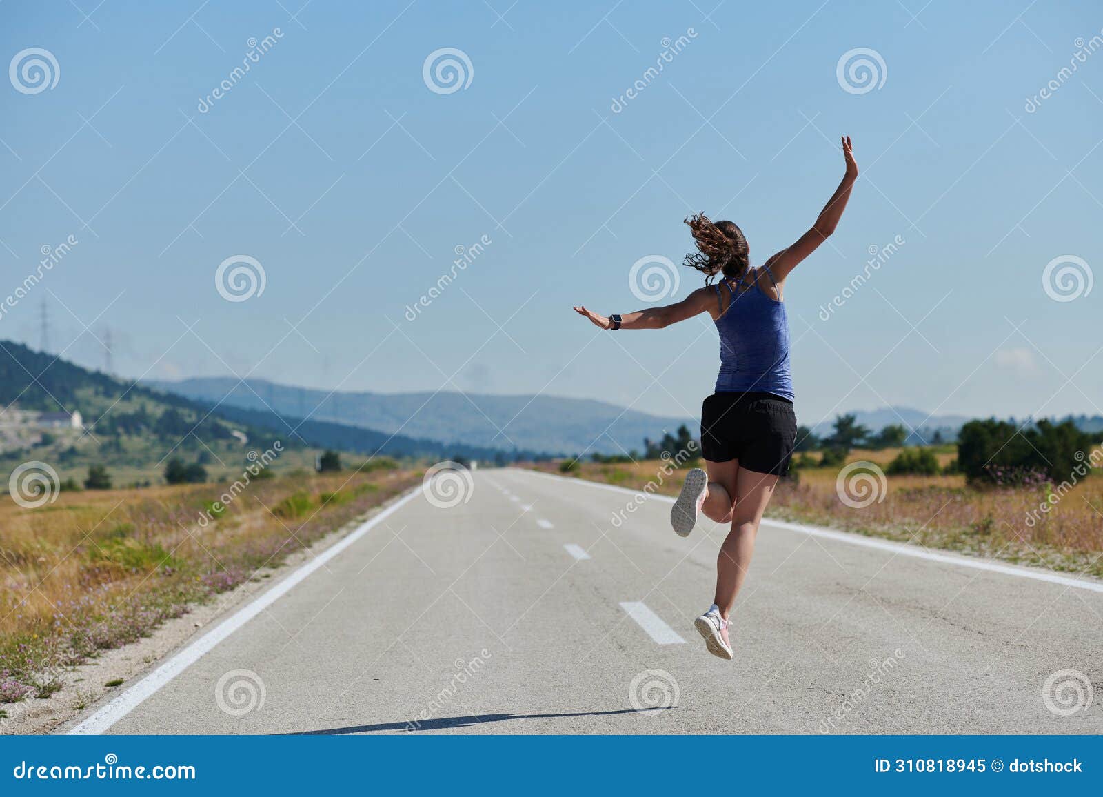 Leap of Victory: Athlete Symbolizes Success and Dedication through Mid ...