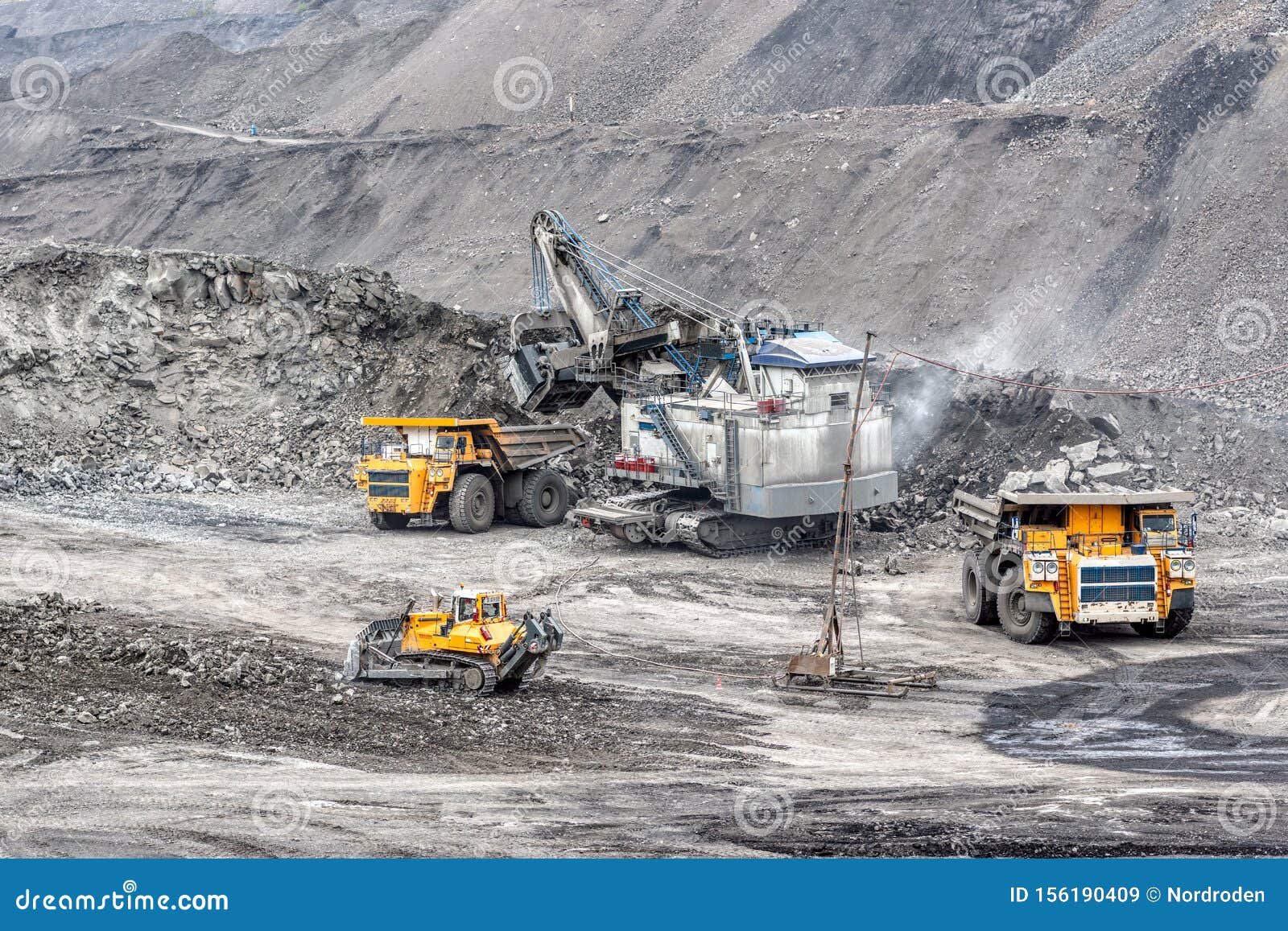 A Powerful Excavator Loads Mining Trucks. Stock Image - Image of site ...