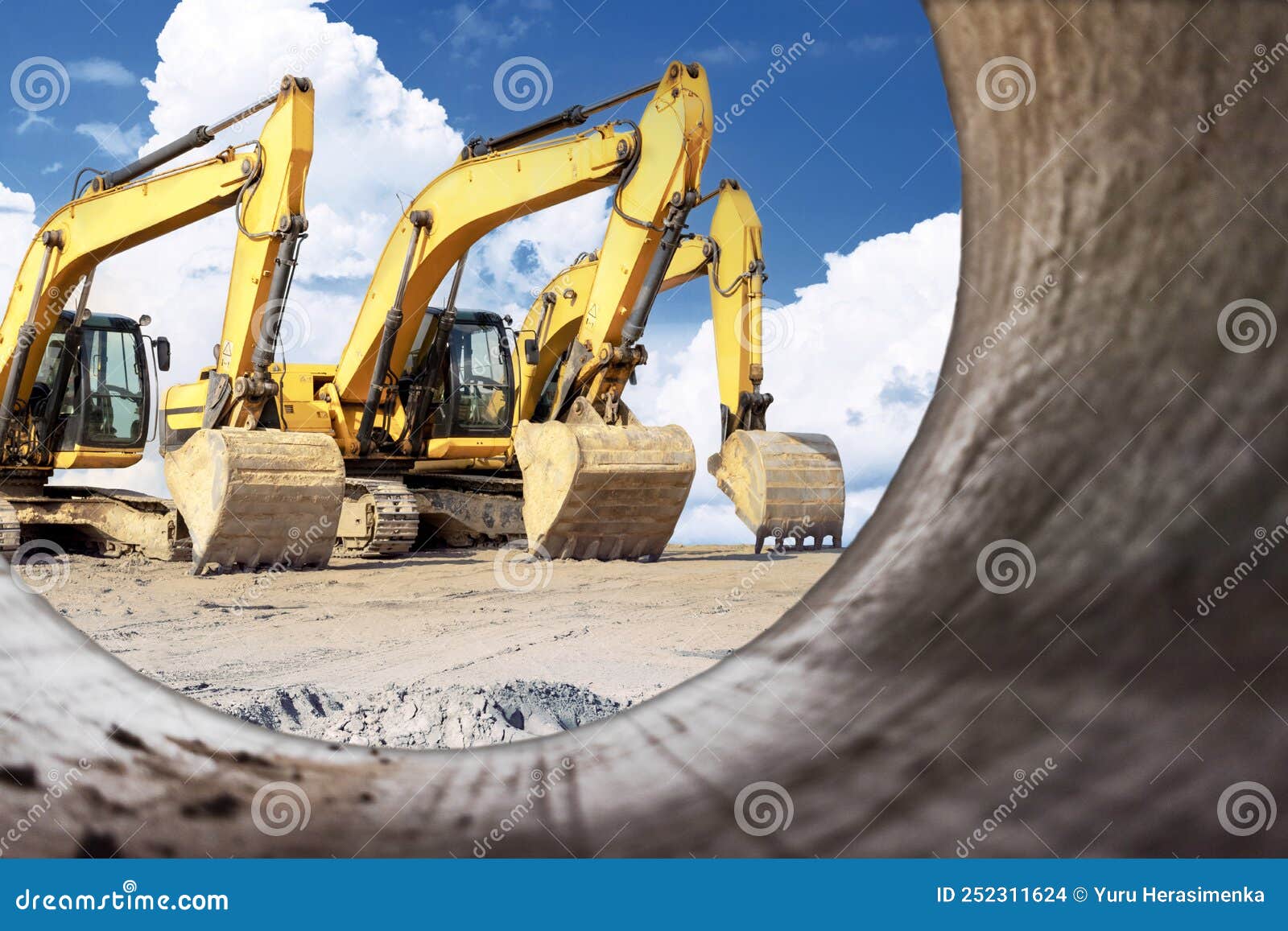 Powerful Excavators at a Construction Site Viewed from a Large Diameter ...