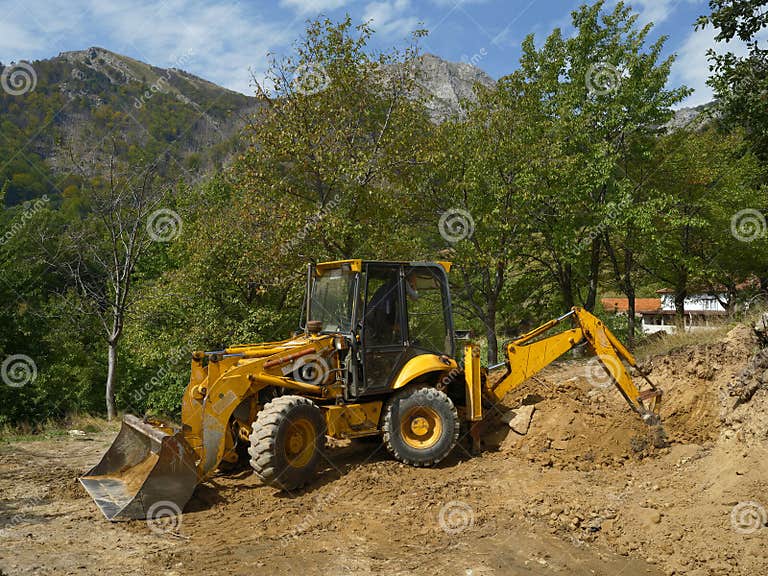 Powerful Front Wheel Loader or Bulldozer Working on a Construction Site ...