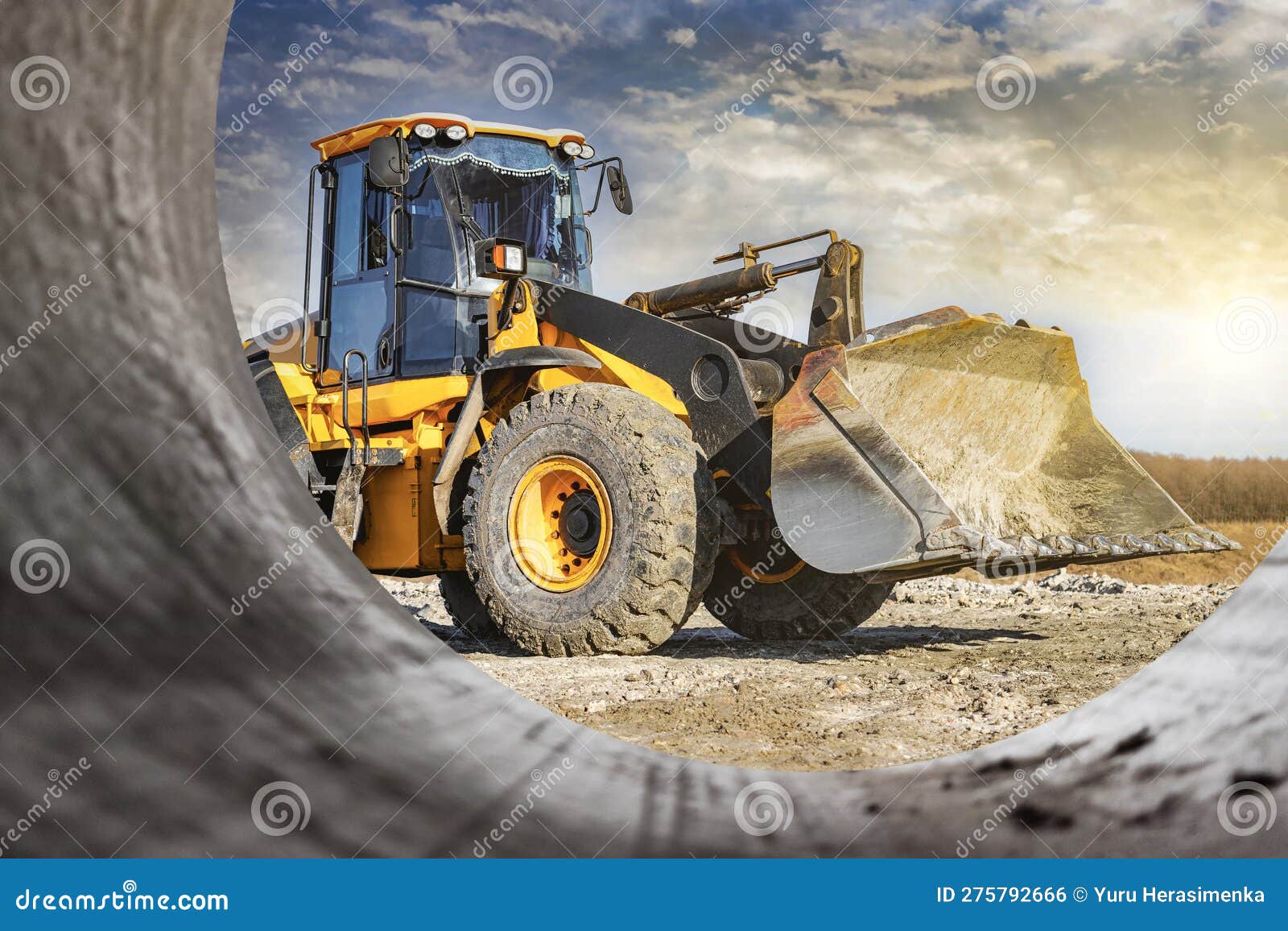 Powerful Front Wheel Loader or Bulldozer Working on a Quarry or ...