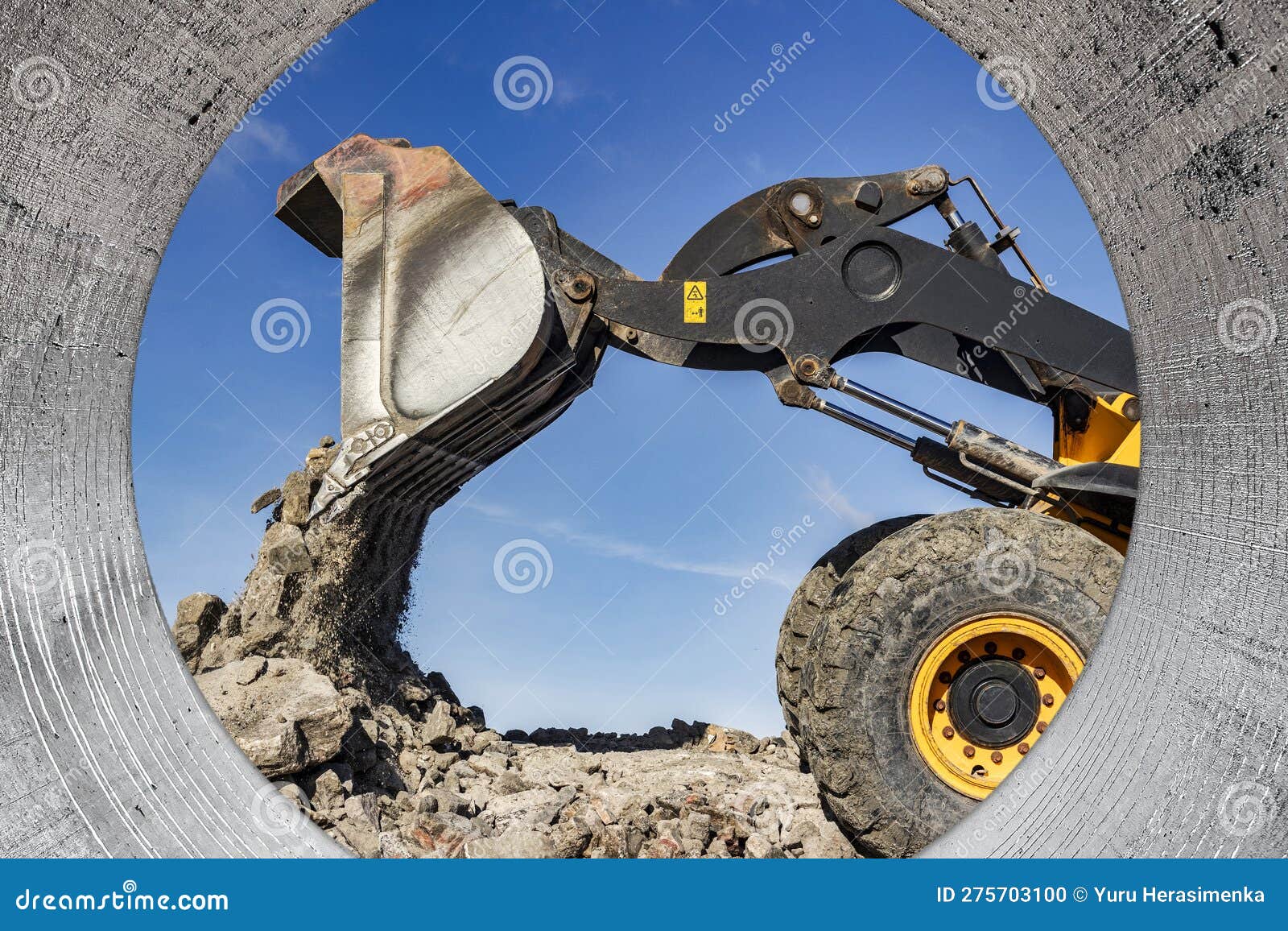 Powerful Front Wheel Loader or Bulldozer Working on a Quarry or ...