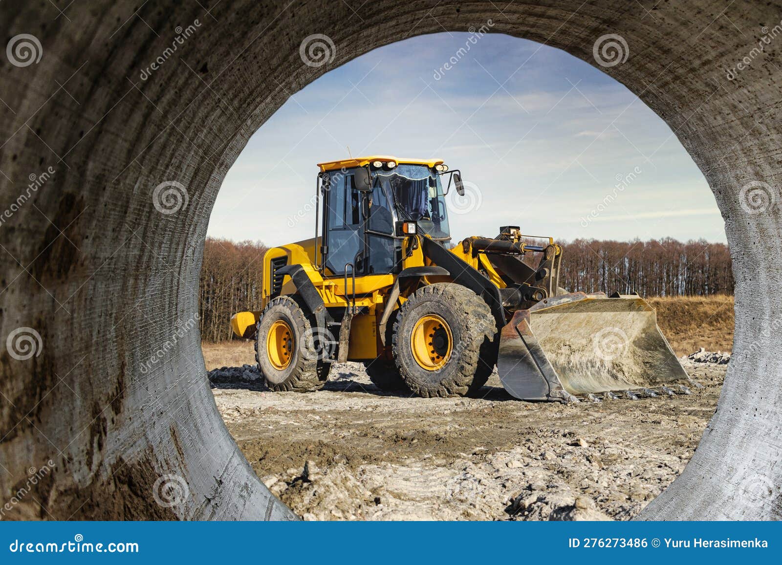 Powerful Front Wheel Loader or Bulldozer Working on a Quarry or ...