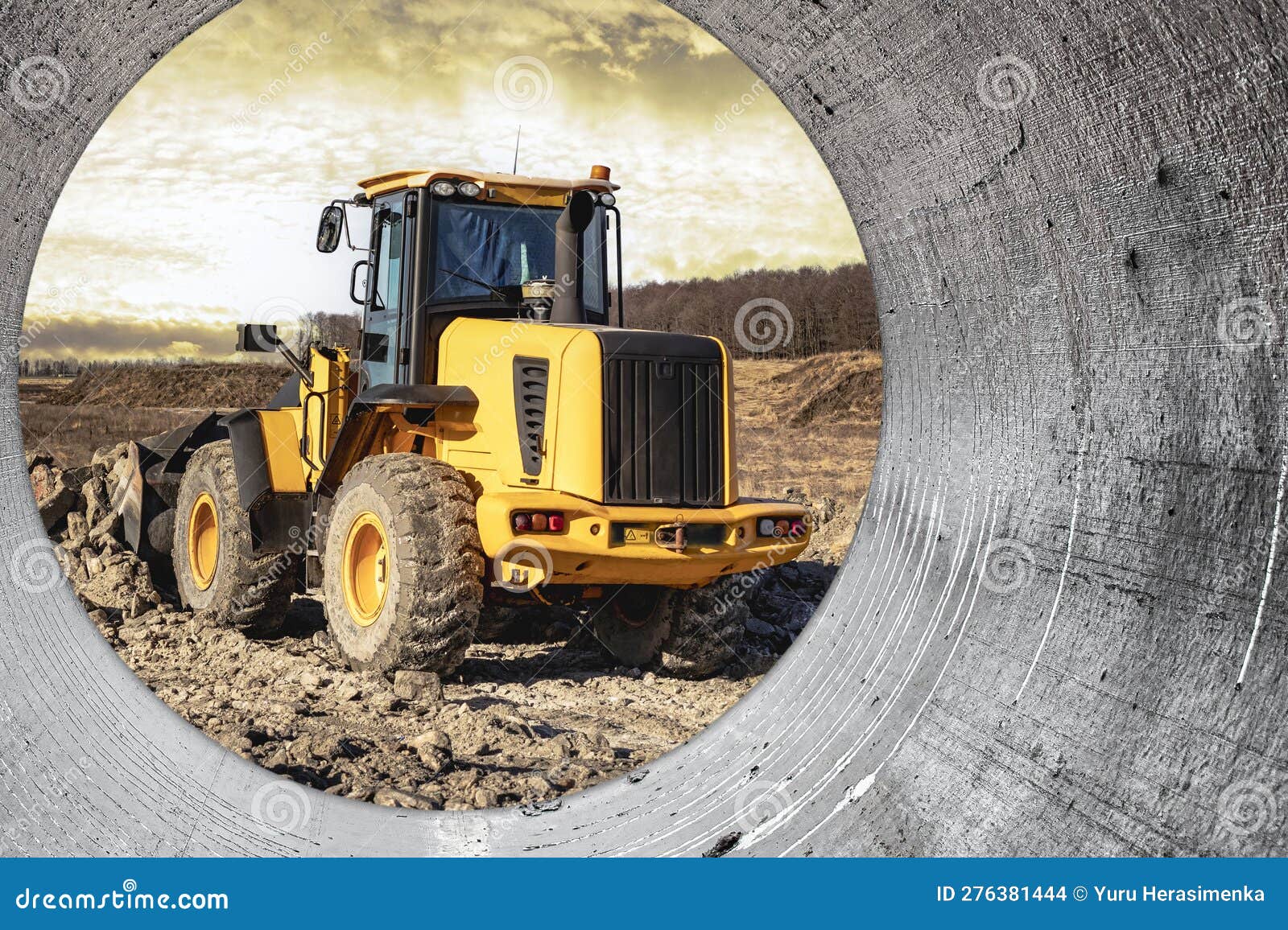 Powerful Front Wheel Loader or Bulldozer Working on a Quarry or ...