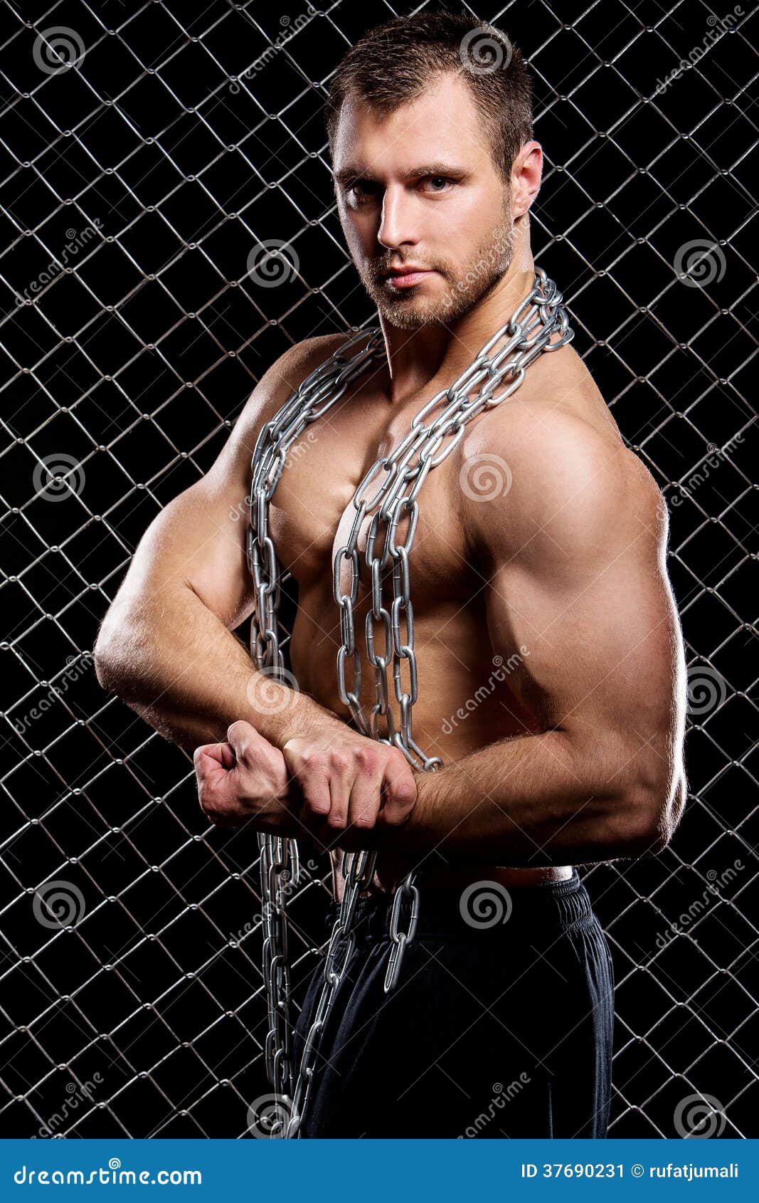 Powerful Guy with a Chain Showing His Muscles Stock Image - Image of ...