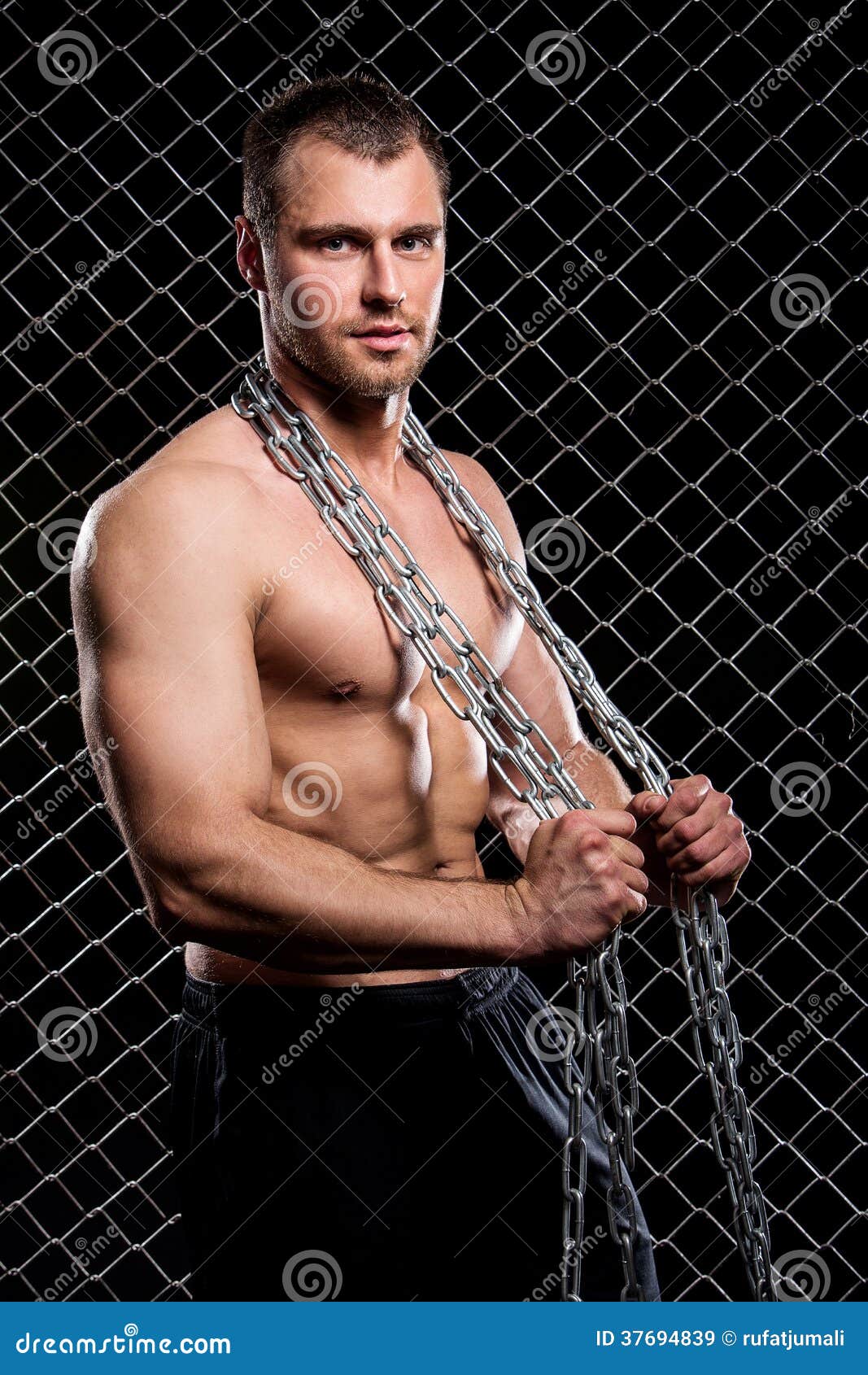 Powerful Guy with a Chain Showing His Muscles Stock Image - Image of ...