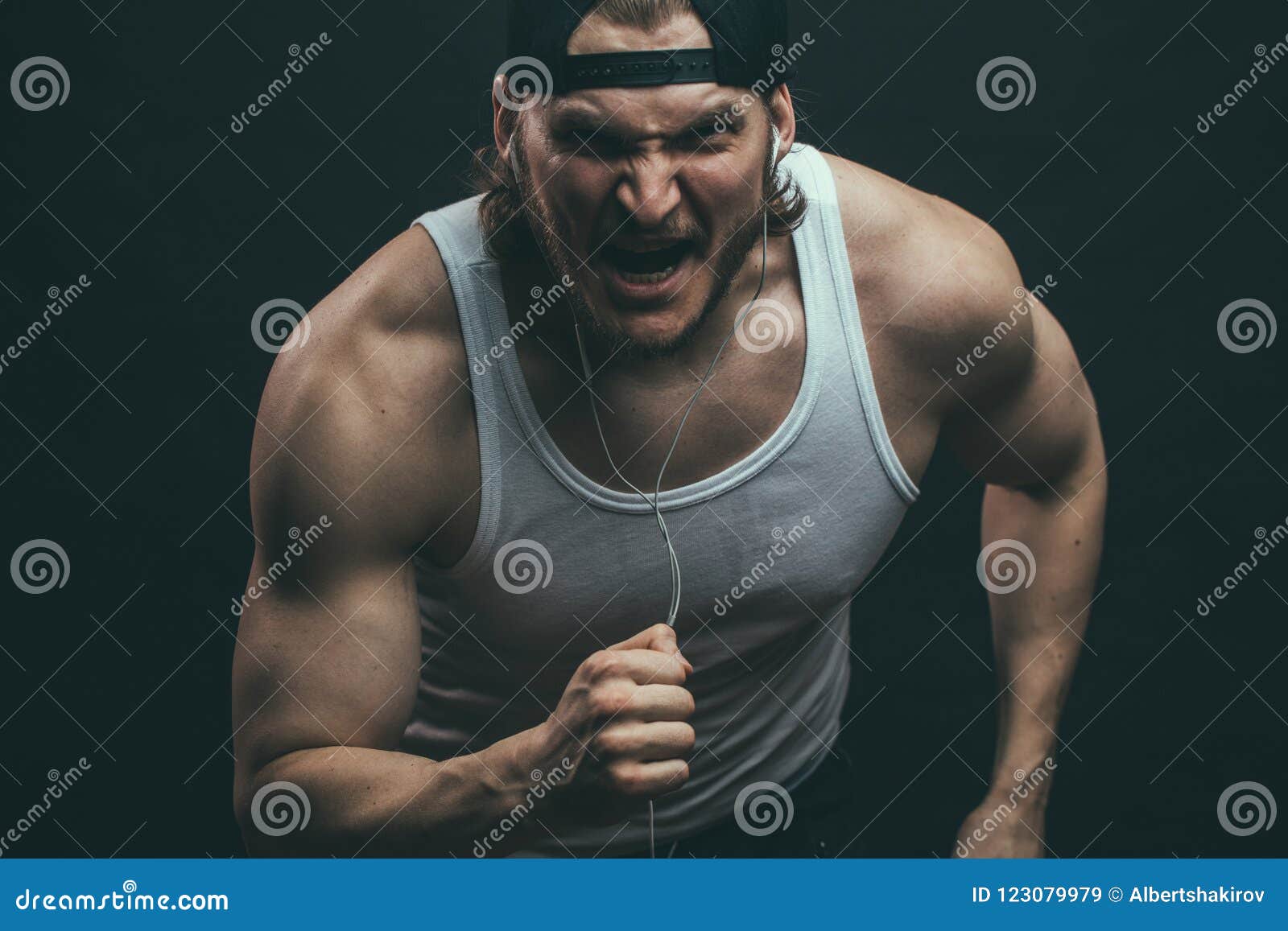 Eager Sportsman Checking Up Hands At Gym. Fighter Getting Ready For ...