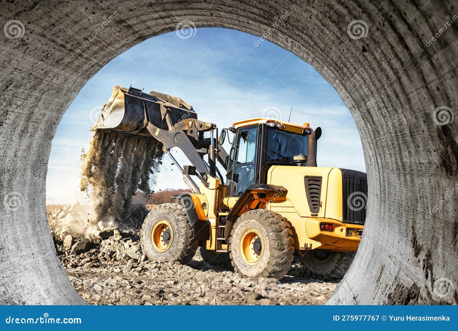 Powerful Wheel Loader or Bulldozer Working on a Quarry or Construction ...