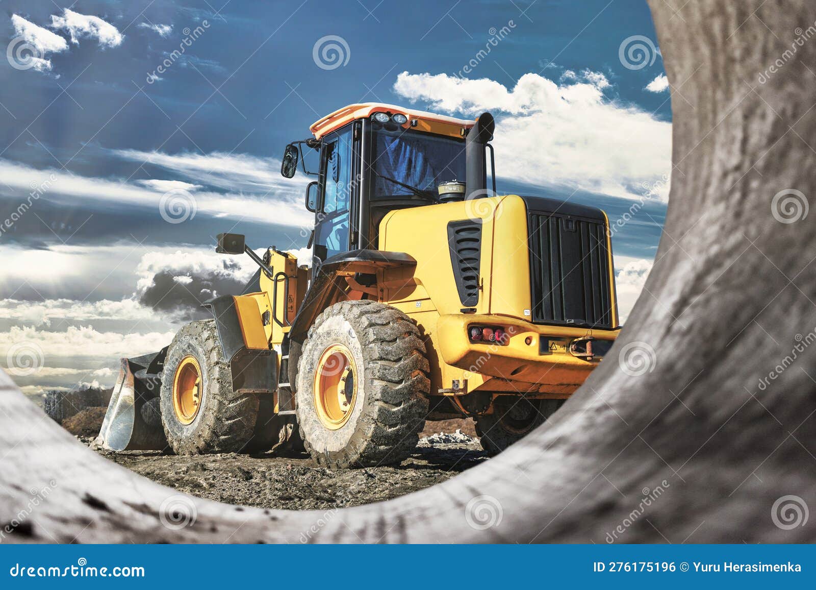 Powerful Wheel Loader or Bulldozer Working on a Quarry or Construction ...