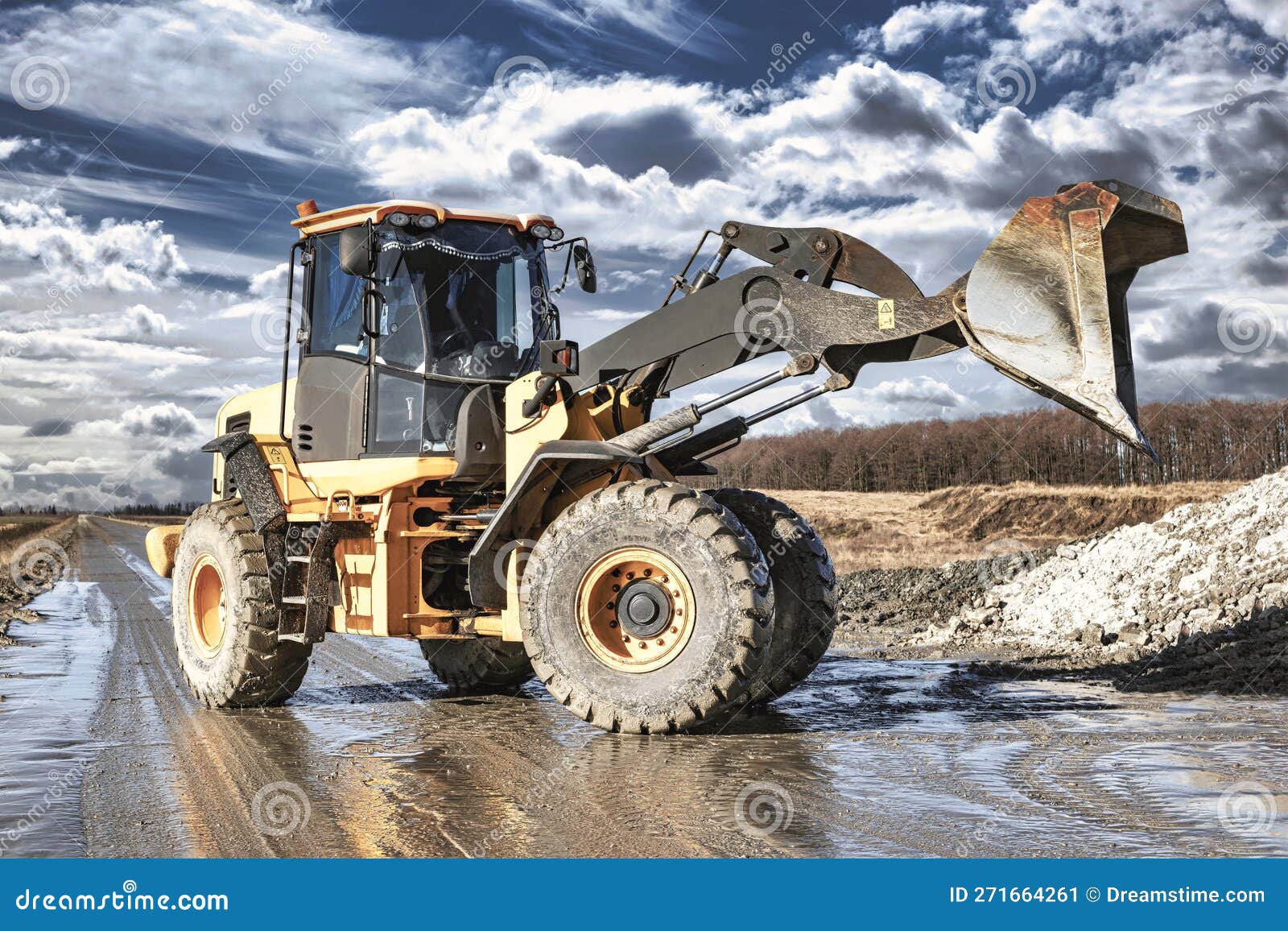Powerful Wheel Loader or Bulldozer Working on a Quarry or Construction ...