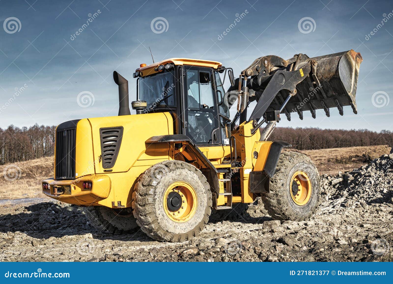 Powerful Wheel Loader or Bulldozer Working on a Quarry or Construction ...