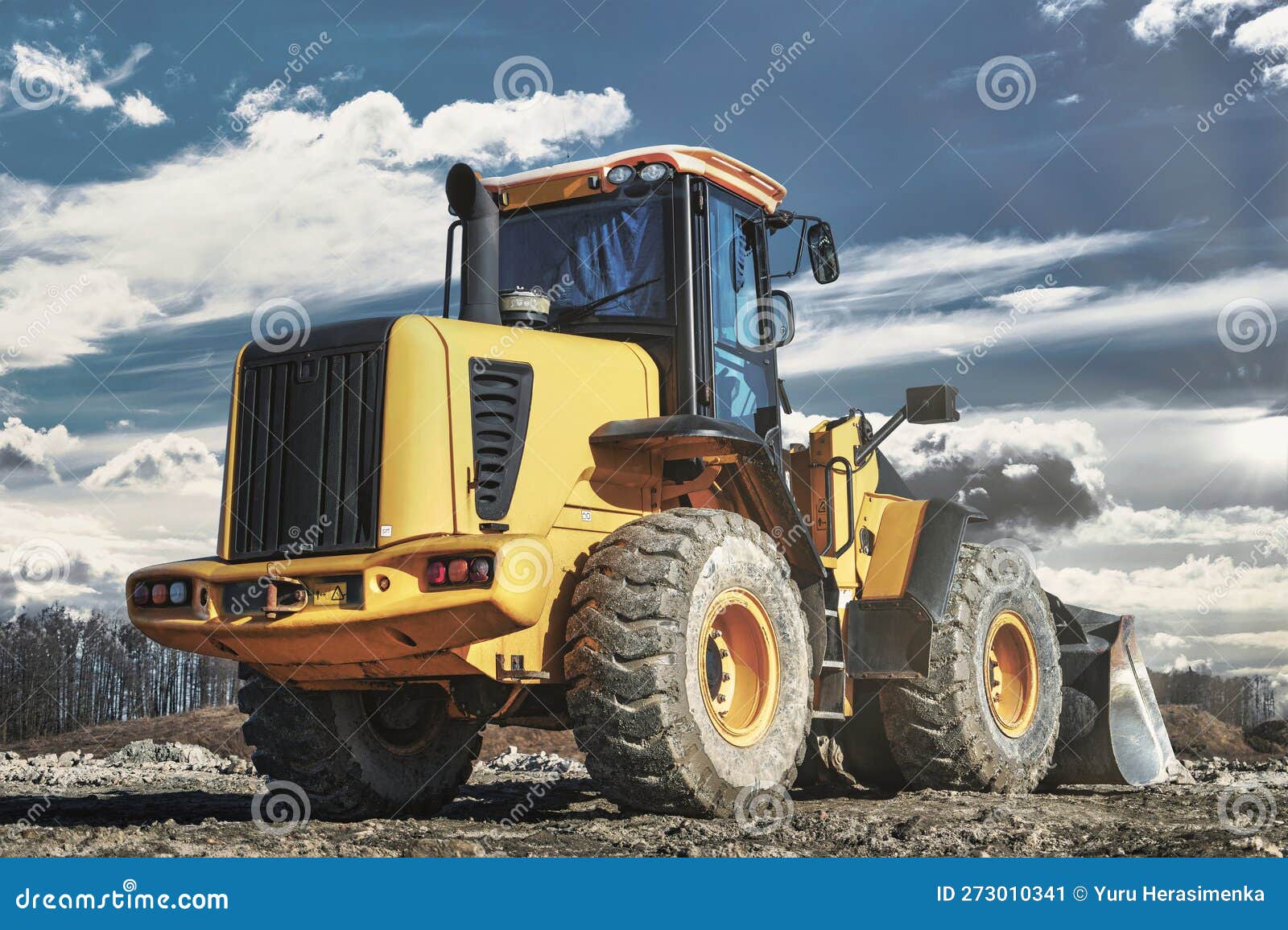 Powerful Wheel Loader or Bulldozer Working on a Quarry or Construction ...