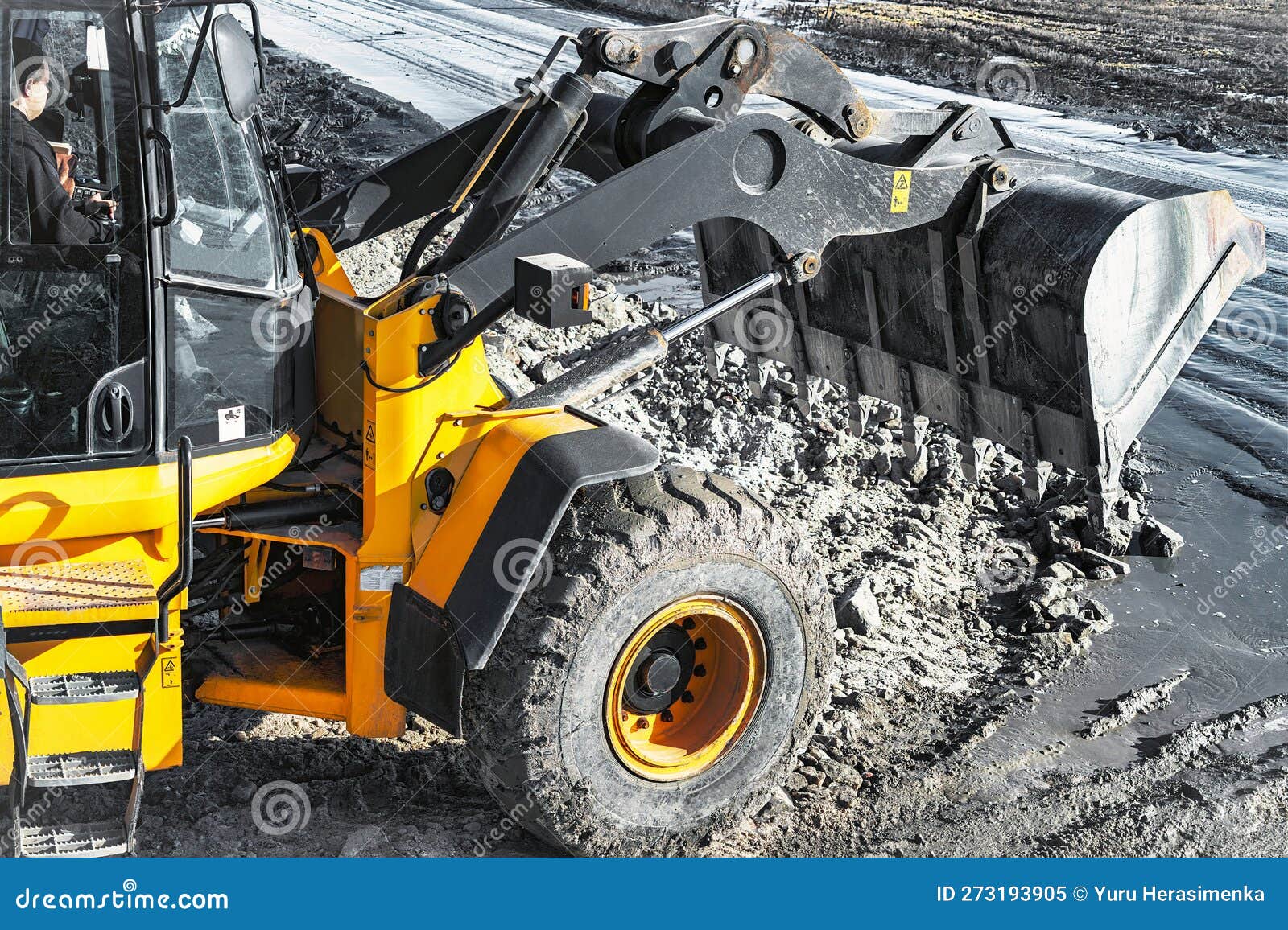 Powerful Wheel Loader or Bulldozer Working on a Quarry or Construction ...