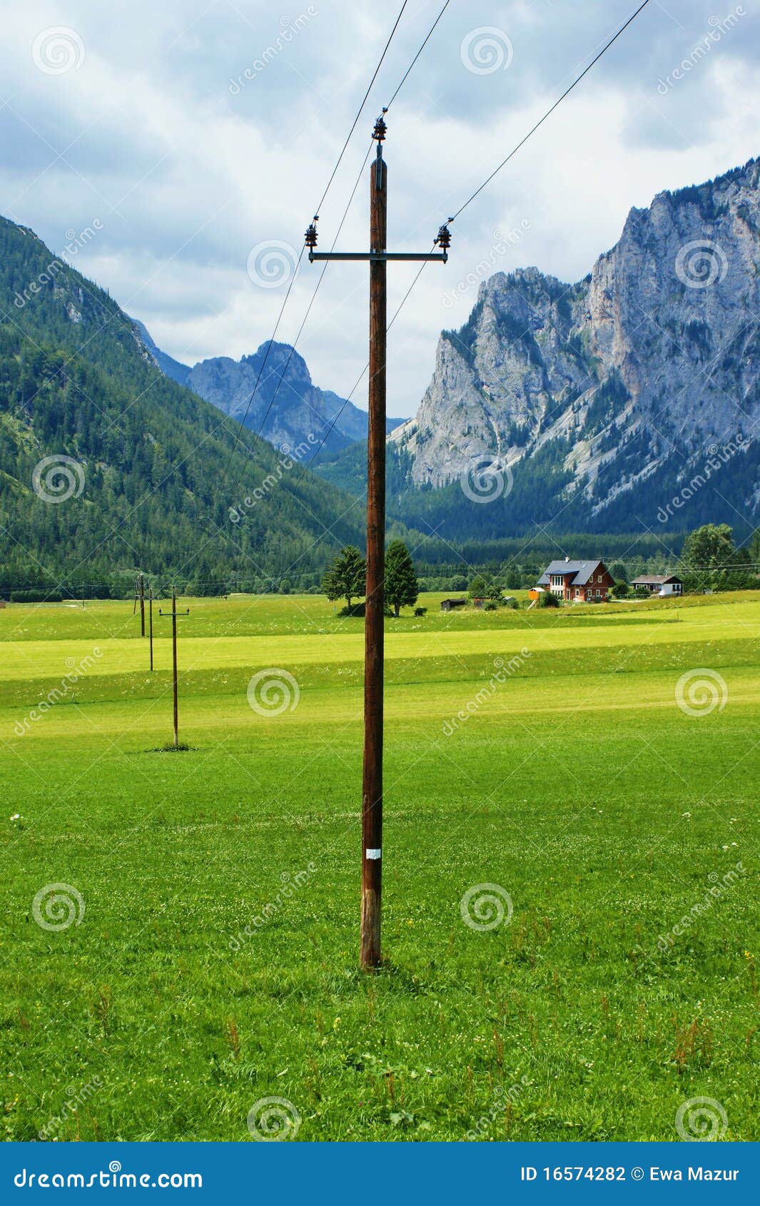 A Wooden Powerline Pole With The Powerline Coming Into The Ground And ...