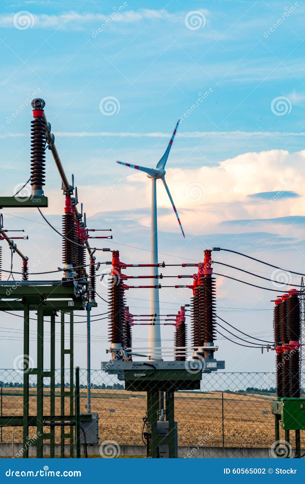 Powerlines and Windmills on the Field Stock Photo - Image of ...