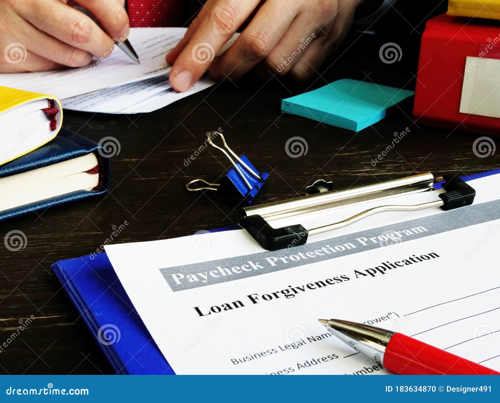 PPP Loan Forgiveness Application for Paycheck Protection Program in the Office Stock Photo ...