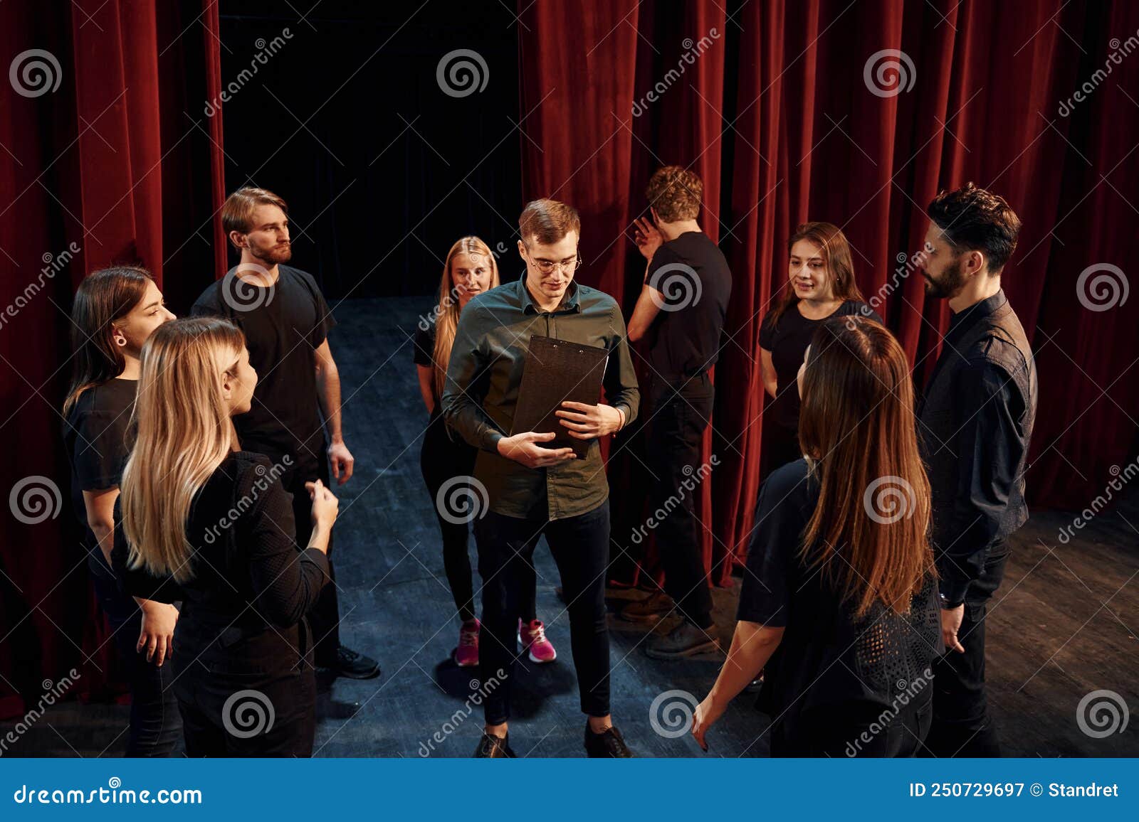 Practice in Progress. Group of Actors in Dark Colored Clothes on ...