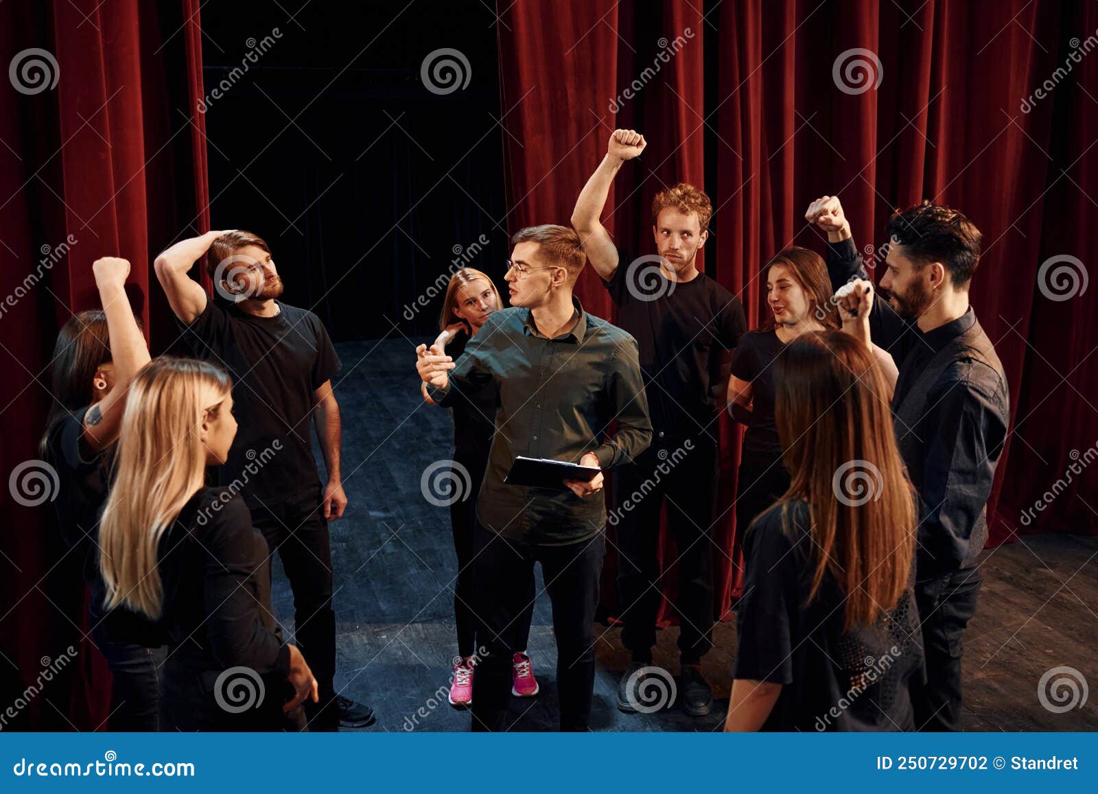Practice in Progress. Group of Actors in Dark Colored Clothes on ...
