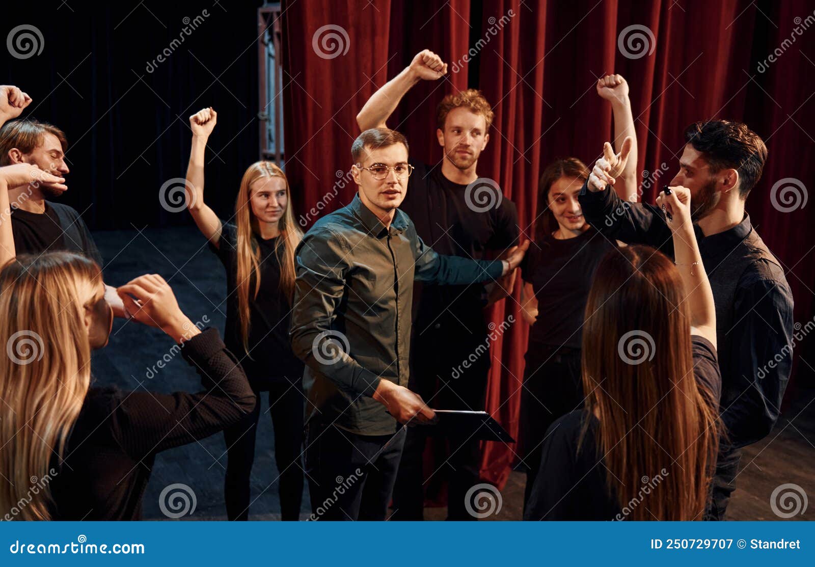 Practice in Progress. Group of Actors in Dark Colored Clothes on ...